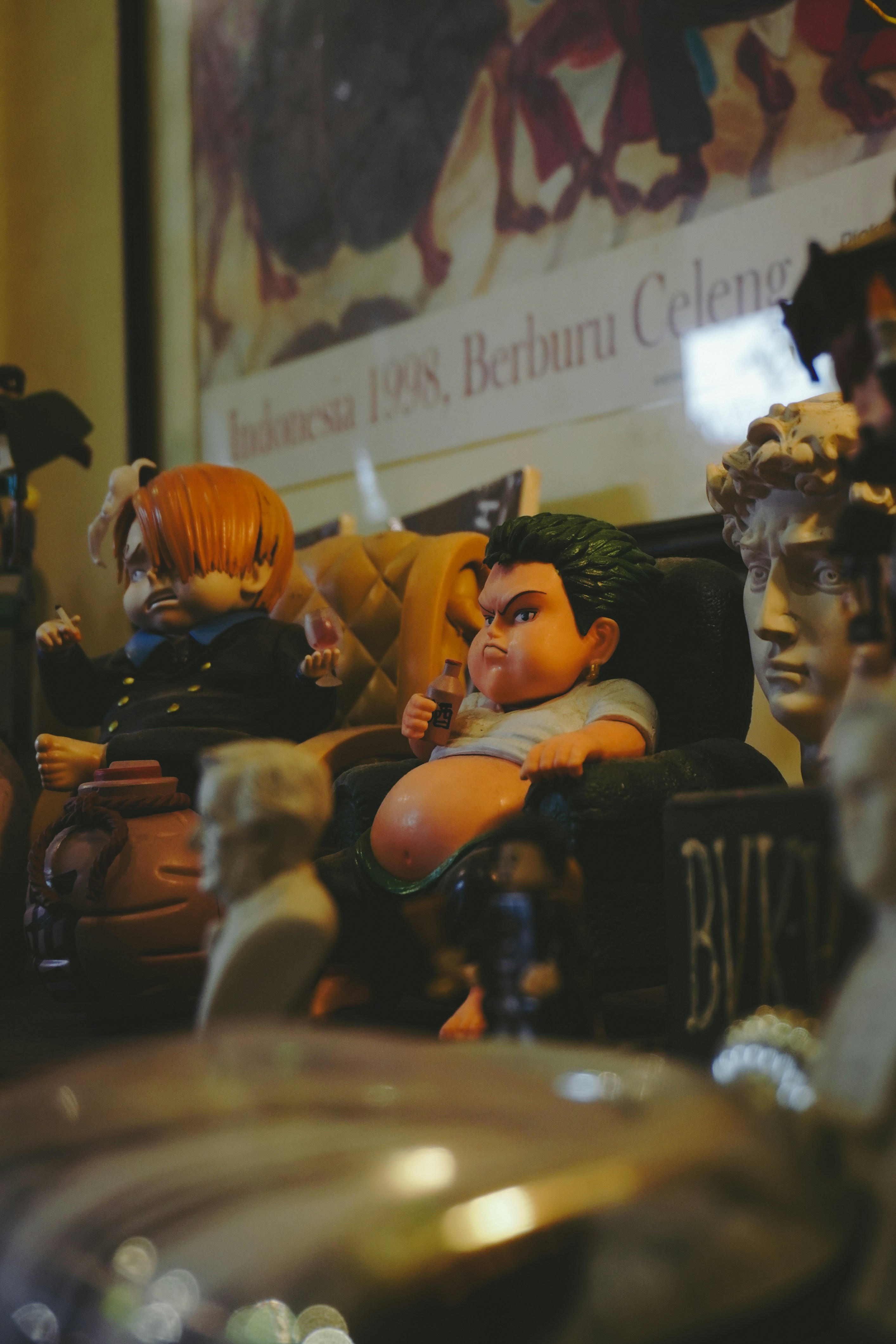 Center Stage on a Row of Quirky Figurines