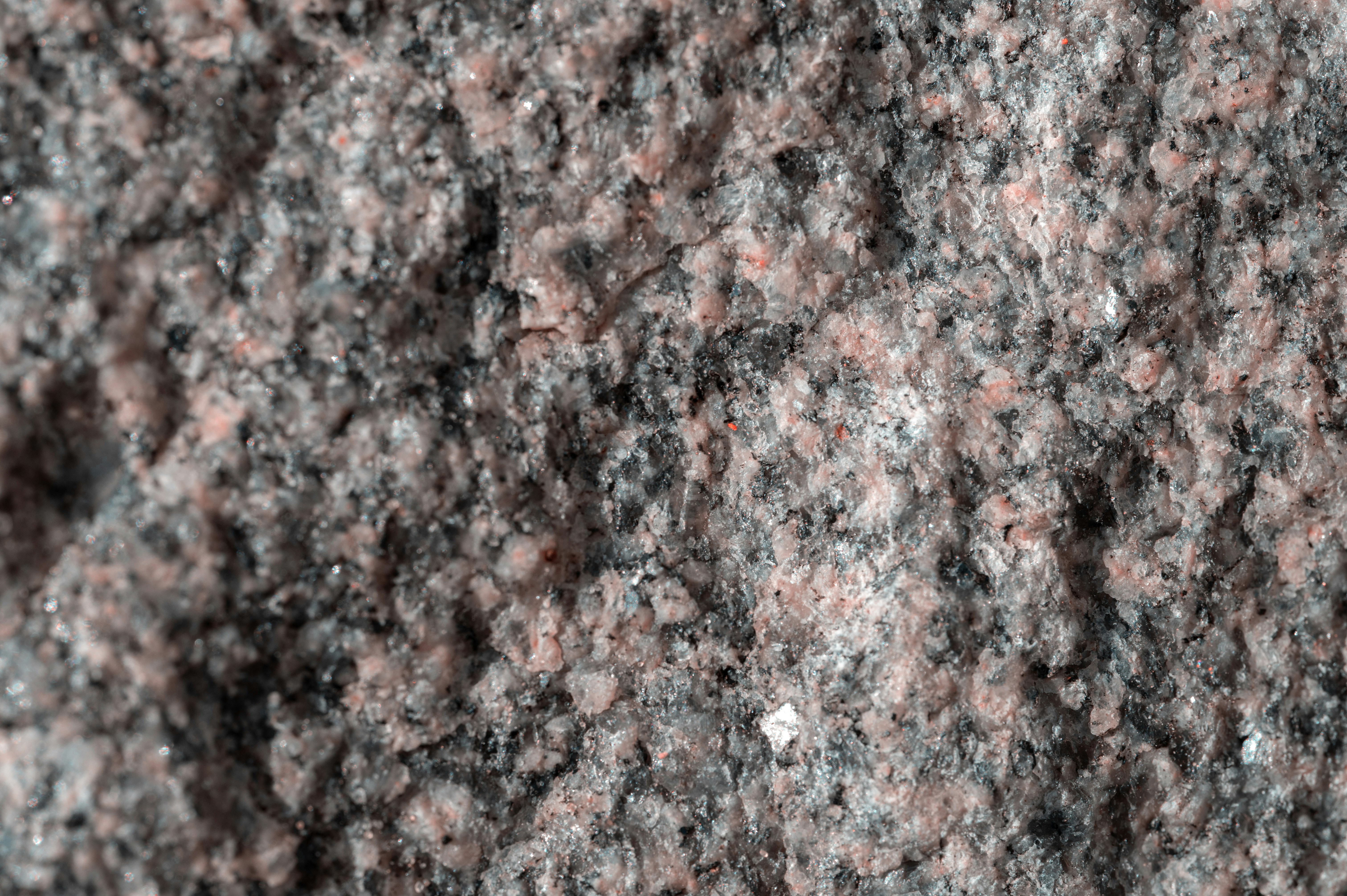 Granite Surface | Close-up of a rough, pink and gray rock.