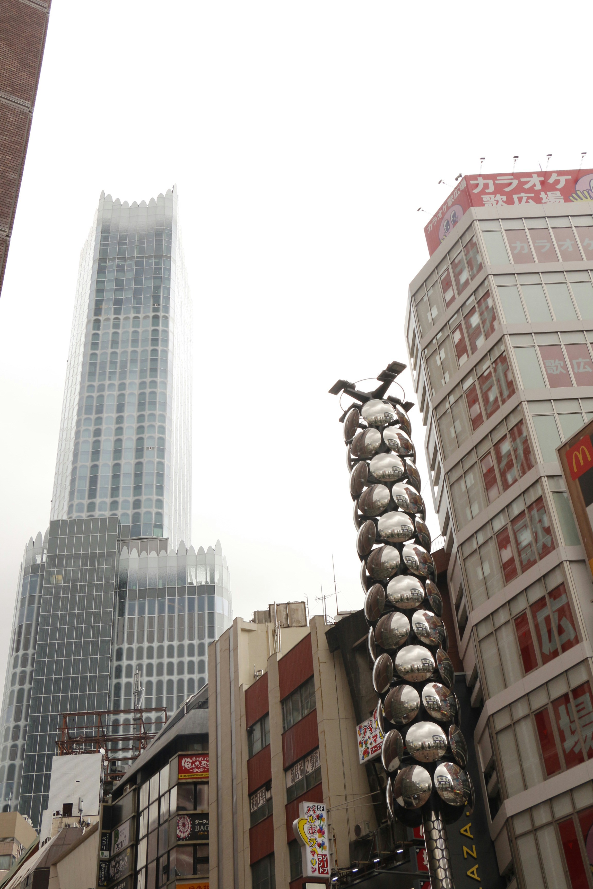 Chrome Spheres Between Glass Giants