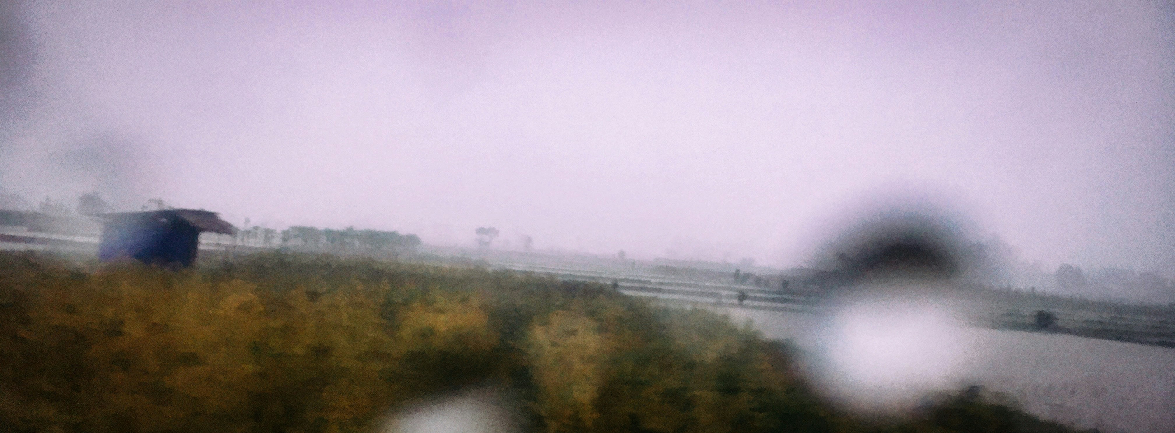 Blue Umbrella at the Edge of Mist