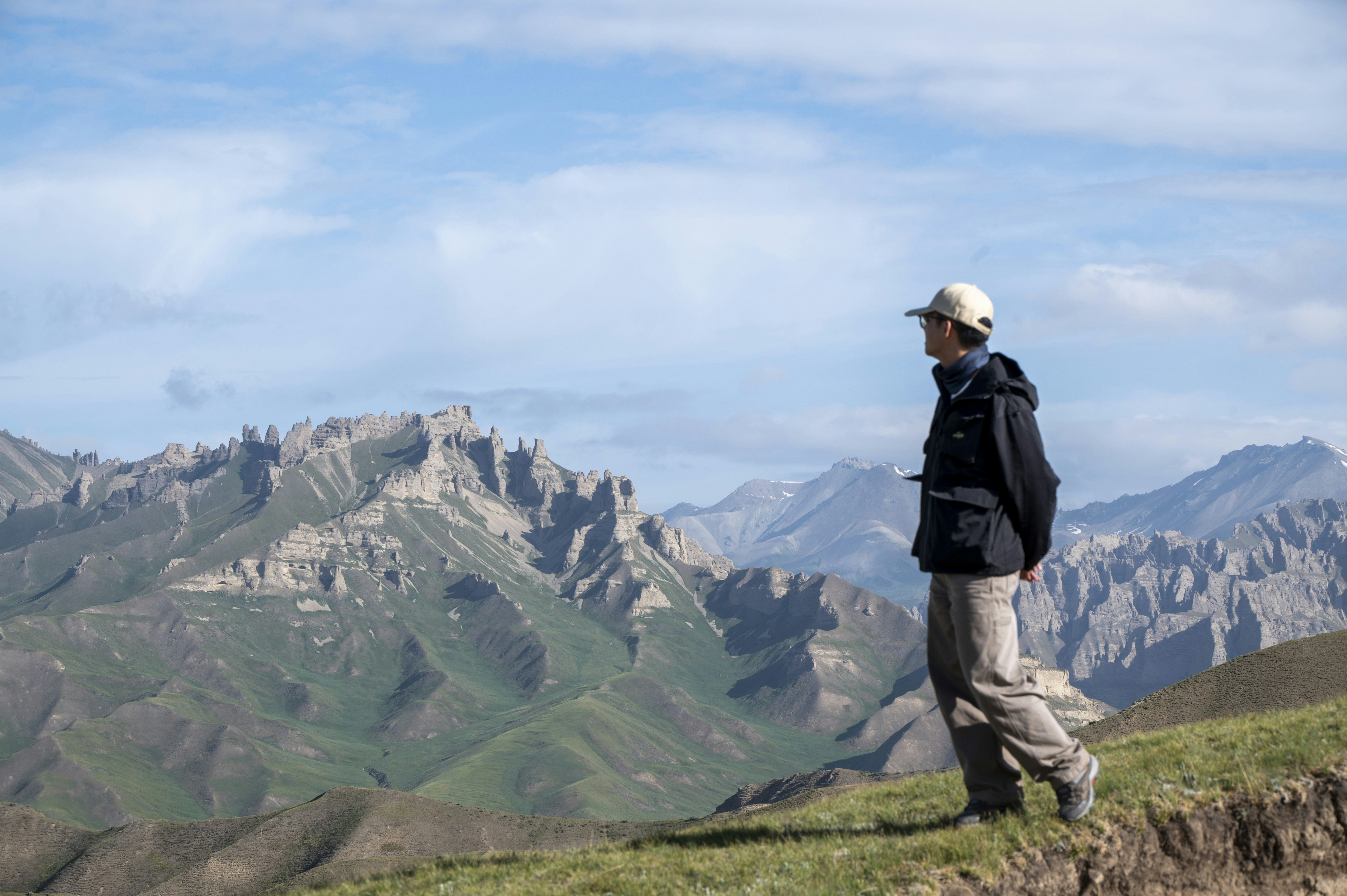 A Solitary Wanderer Amidst Majestic Peaks