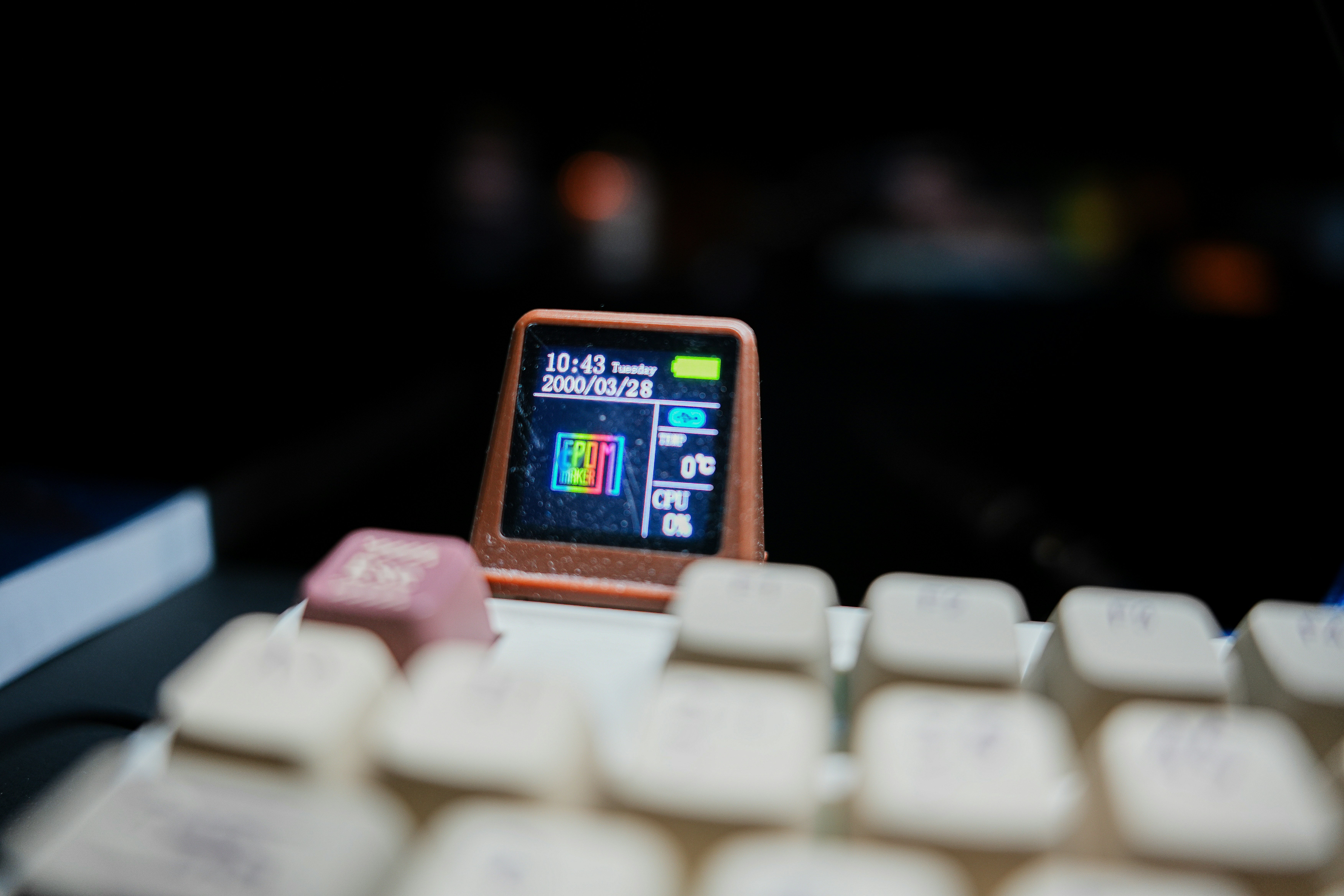 A tiny screen displays colorful graphics and information.