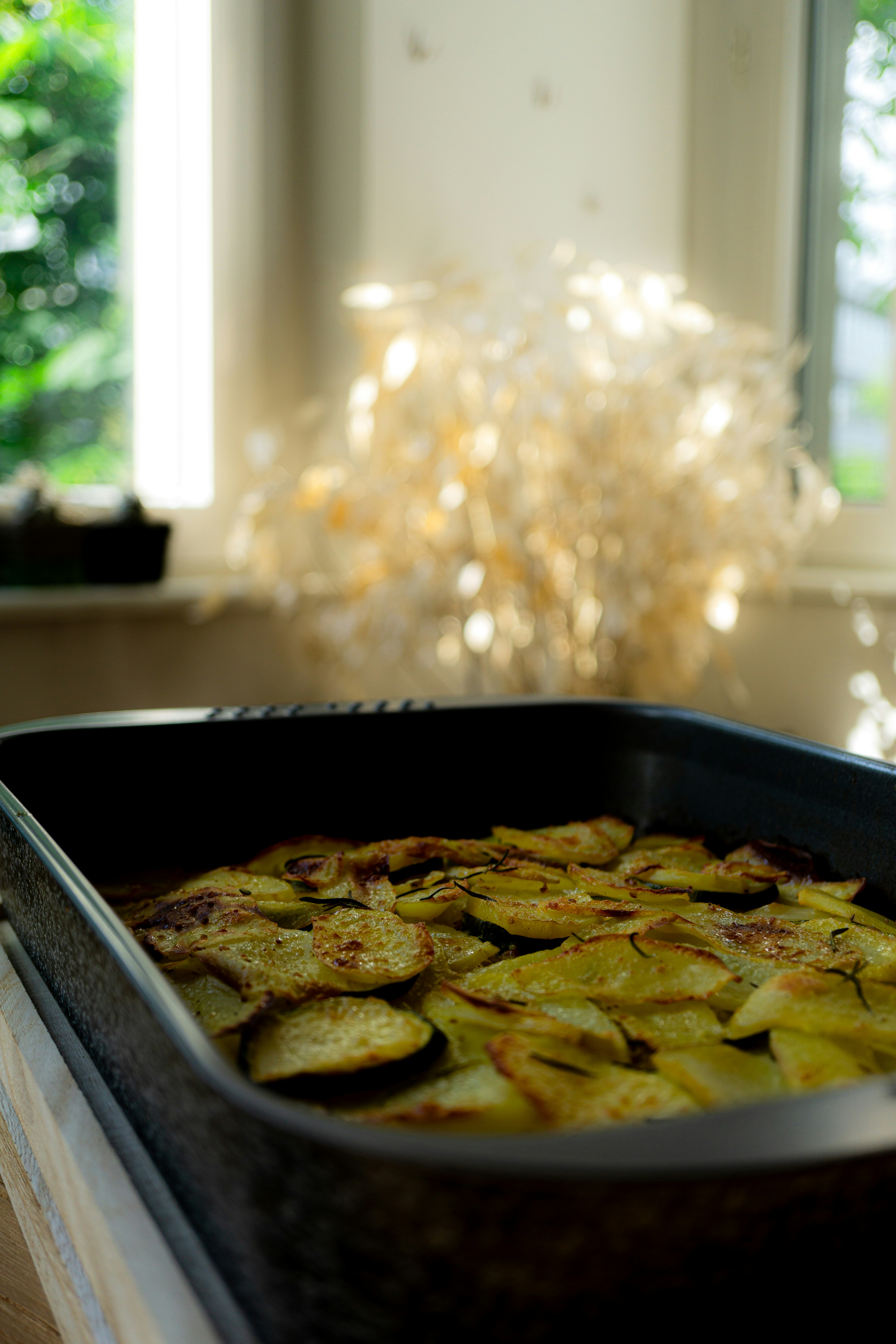 Roasted potato casserole in a baking dish.
