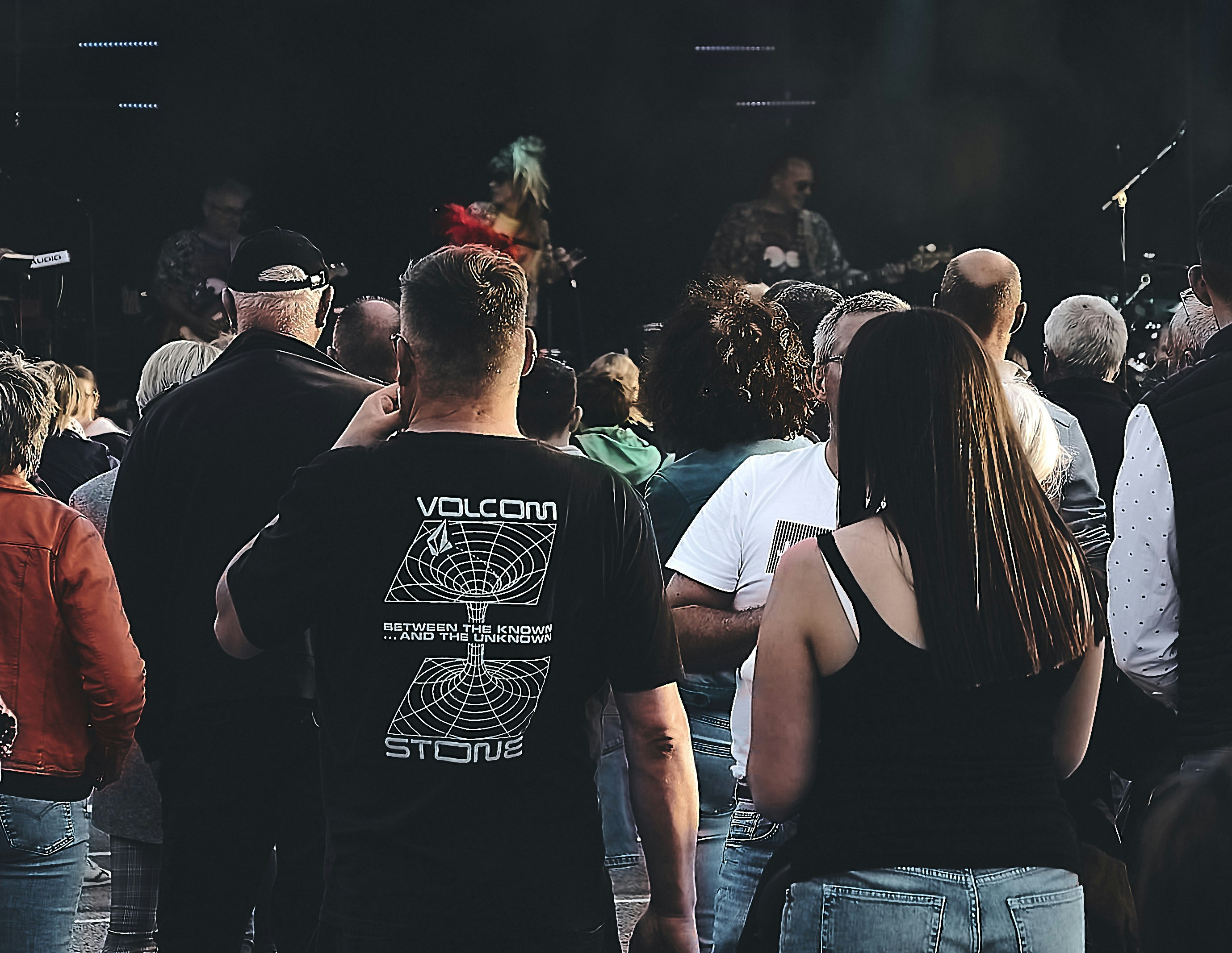 Anchored by a Volcom Tee: Night Crowd Faces the Dim Stage