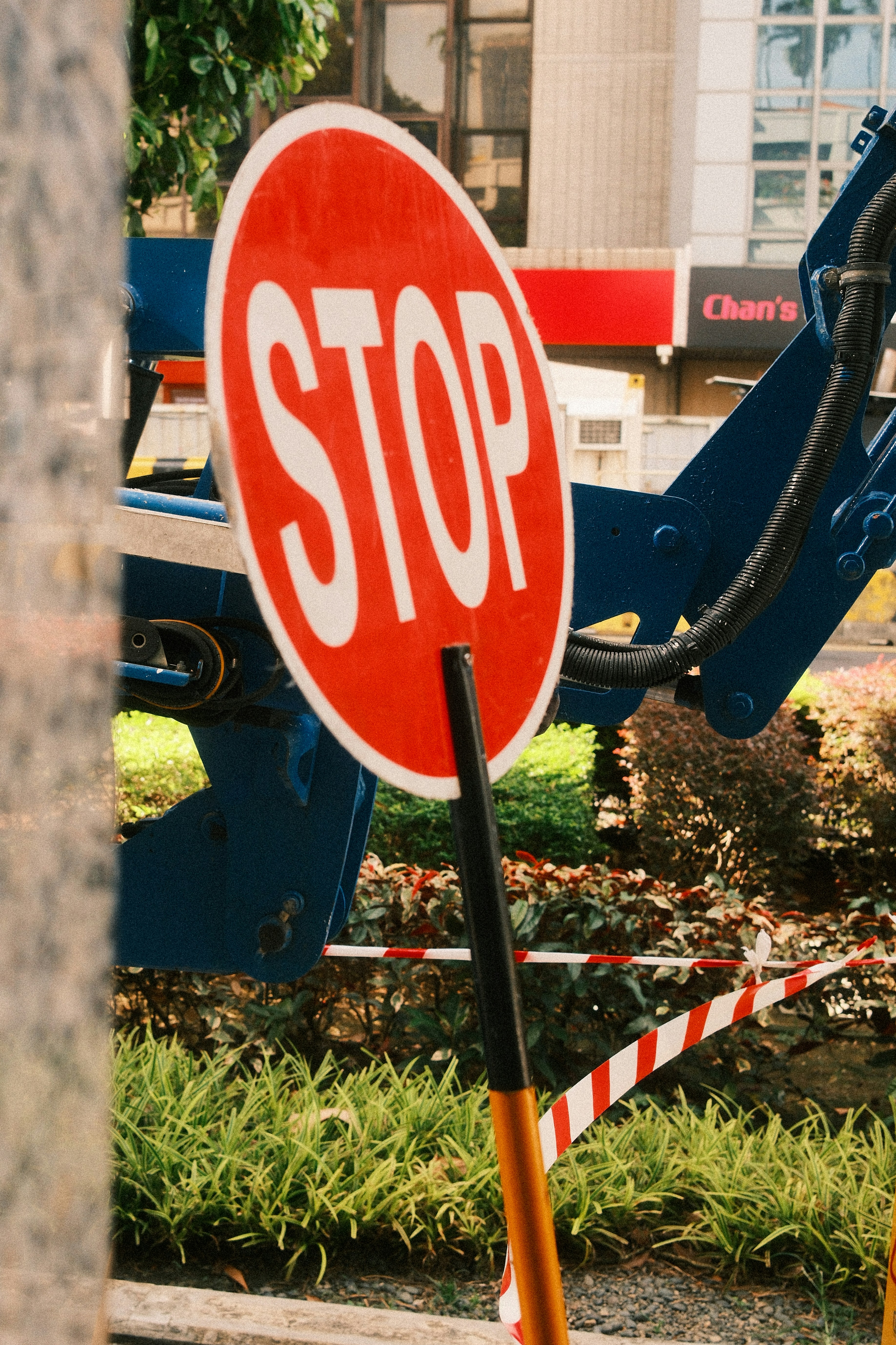 Crimson Sentinel: A Stop Sign Framed by Industrial Blue