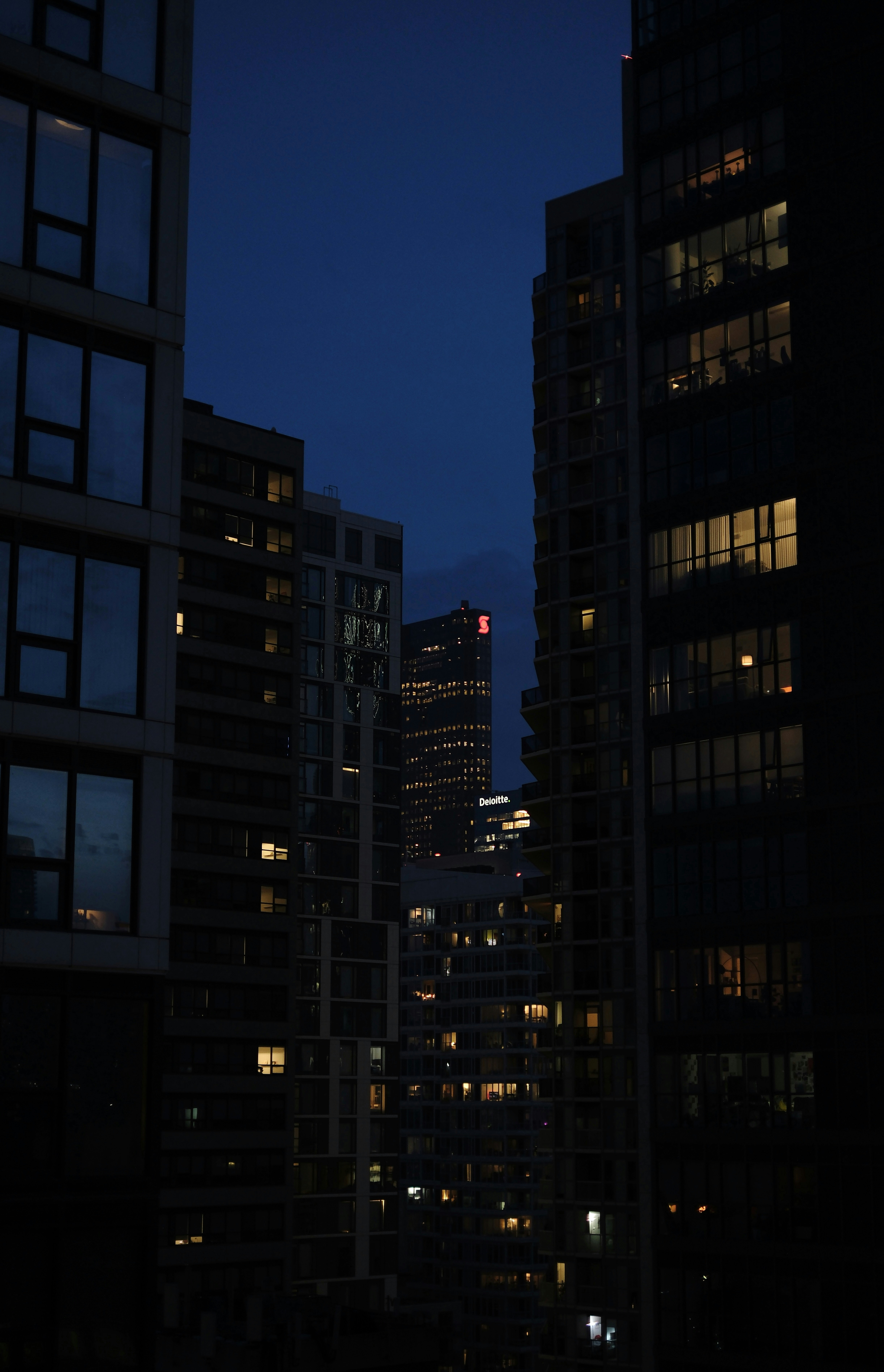 Instagram - @kaprion | City buildings with lights are at dusk.