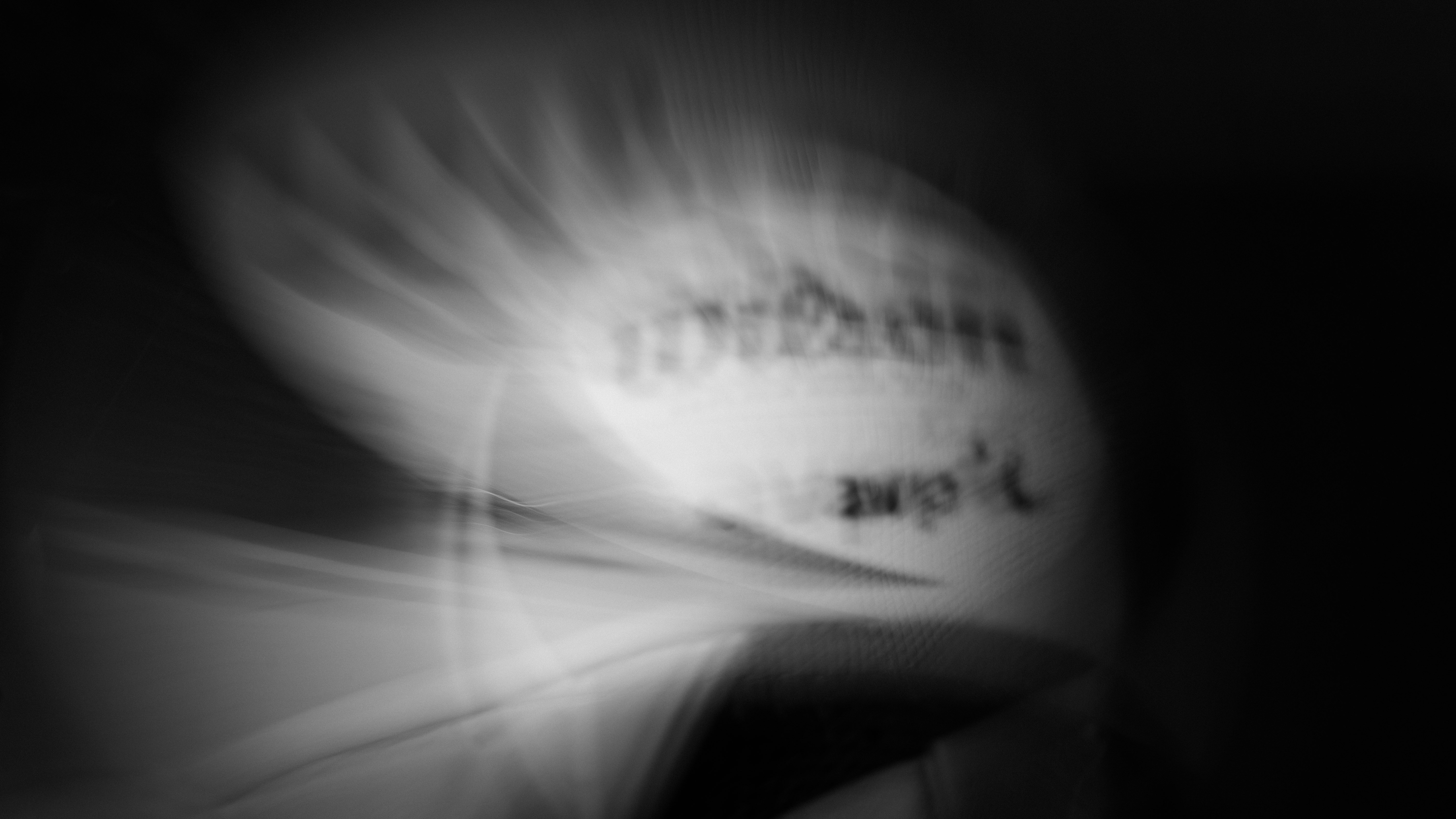 Blurred text shines against a dark background. photo – Free Woman Image ...