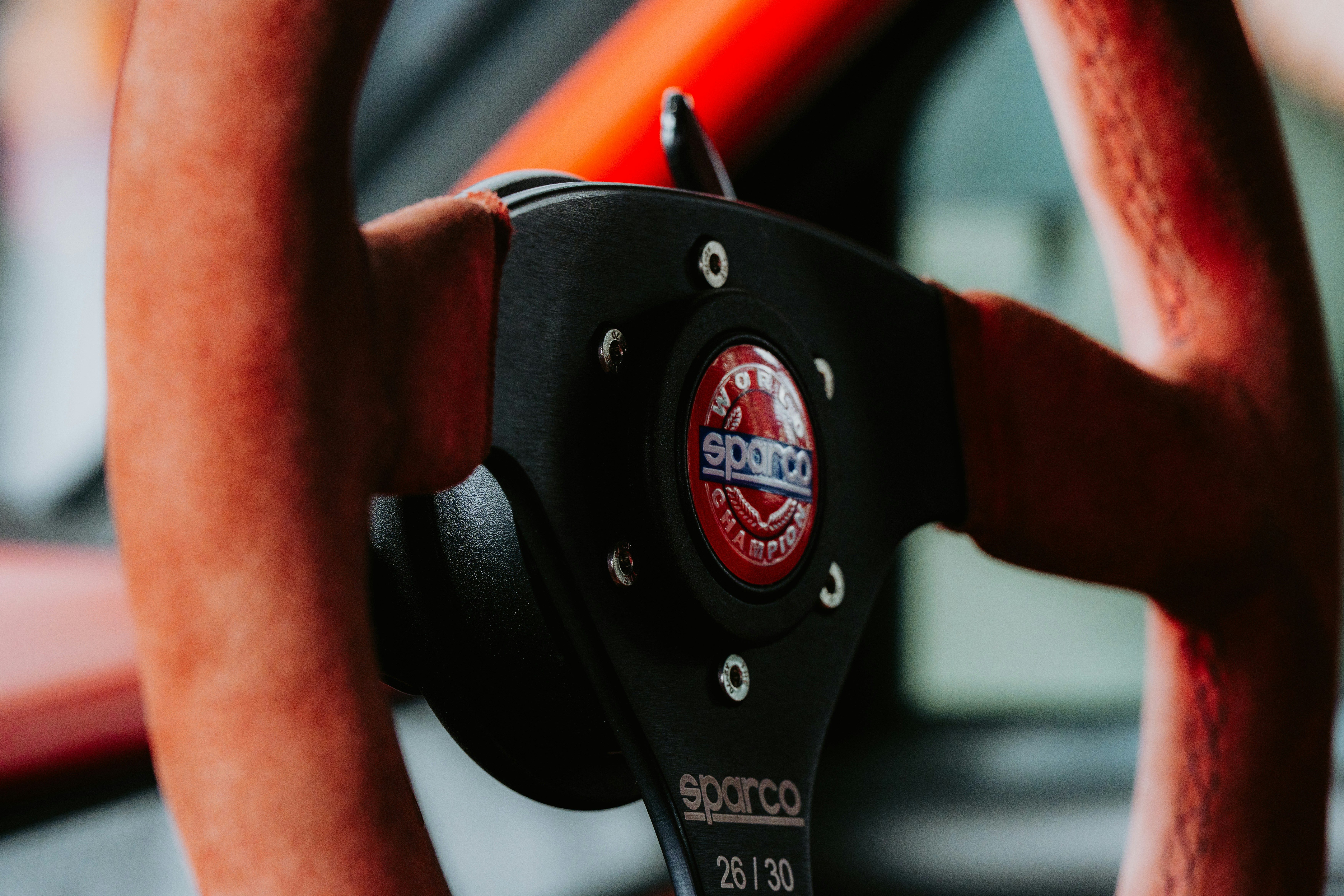 Centered Grip: Sparco Hub in a Red Racing Cabin