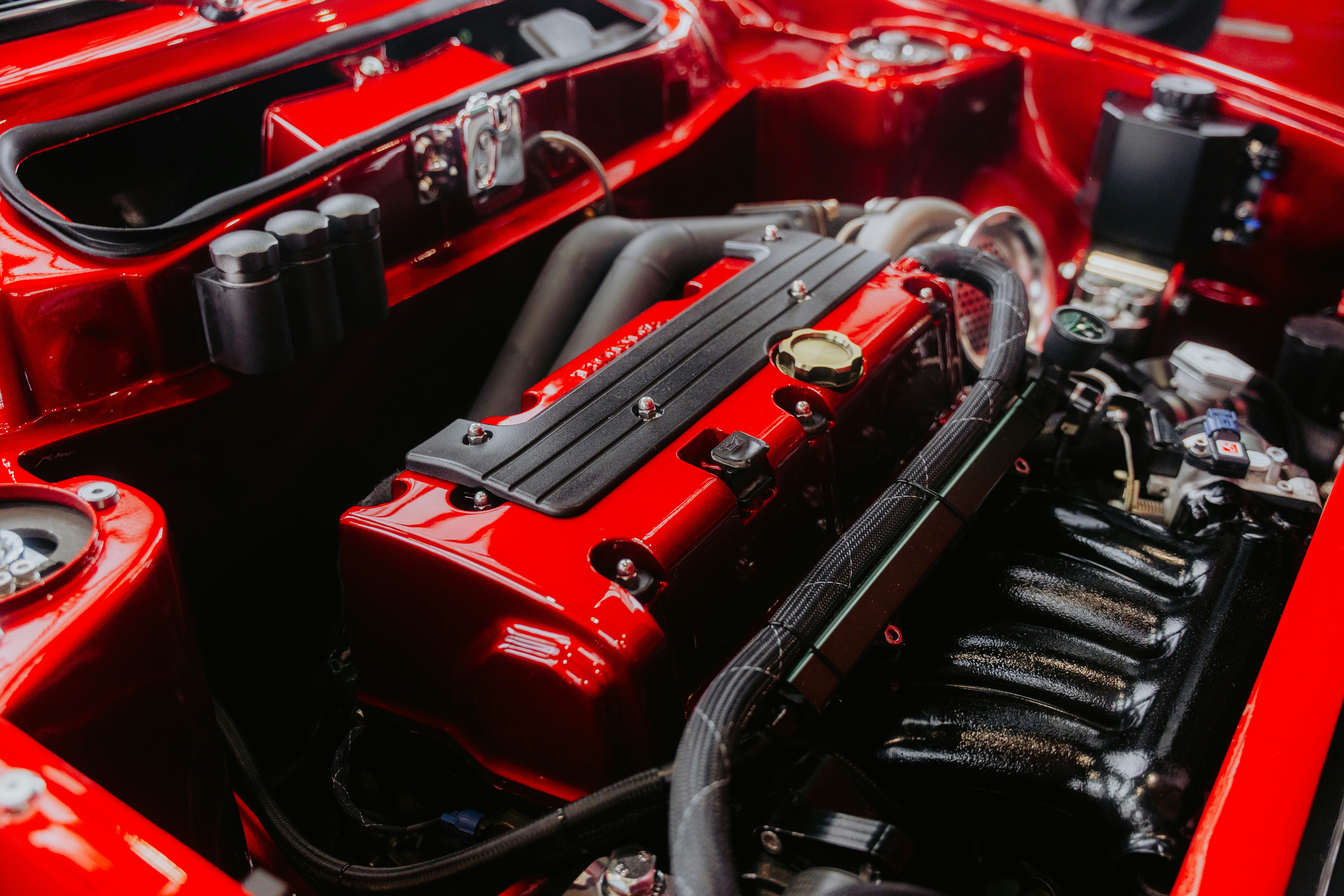 A shiny, red engine bay. photo – Free Image on Unsplash