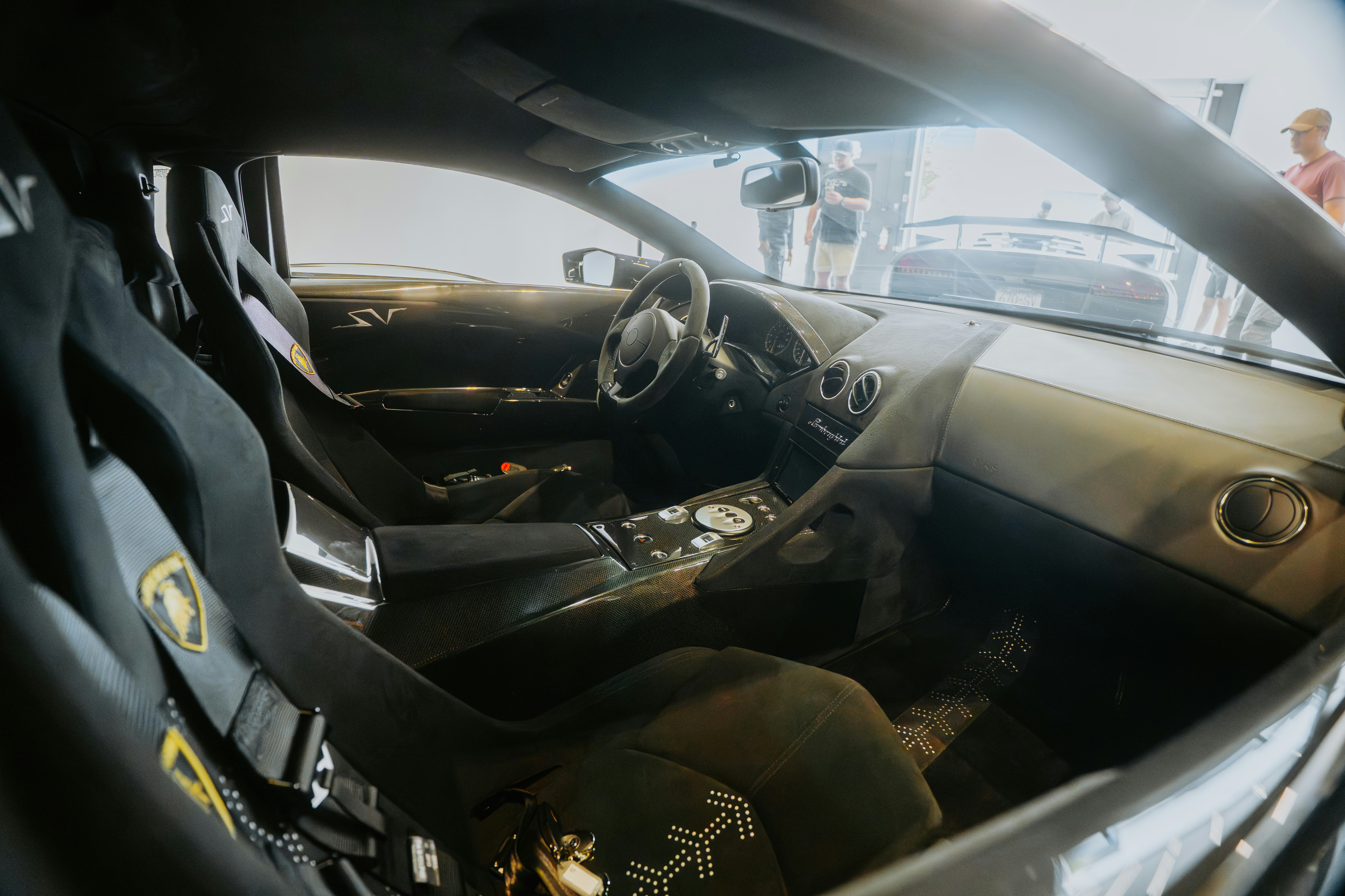 Luxurious interior of a high-performance sports car showcasing sleek design and advanced technology.