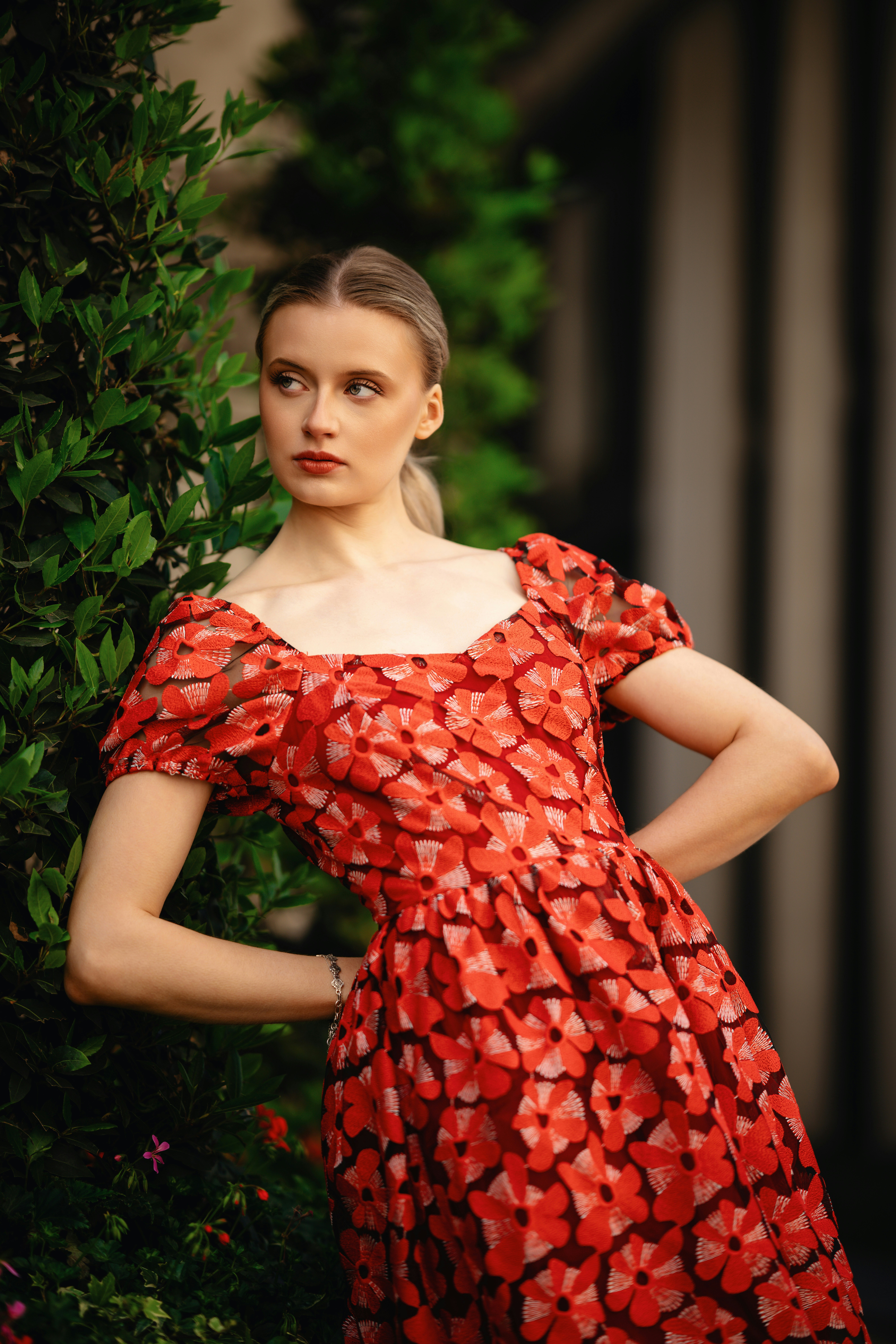 Beautiful woman in red dress poses by greenery. photo – Free Female ...