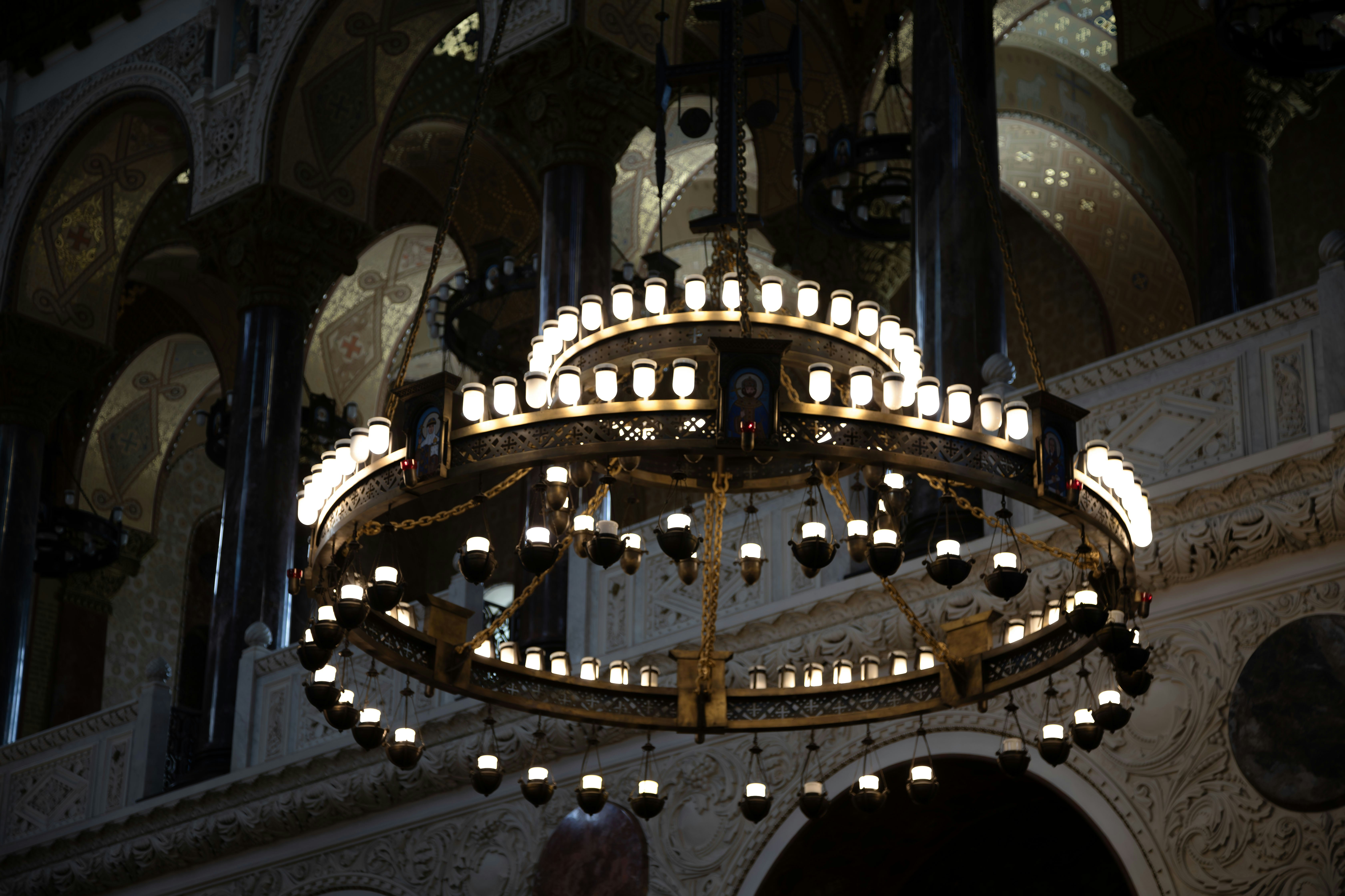 Naval Cathedral of St. Nicholas, Kronstadt, Russia | A large, circular chandelier illuminates the room.