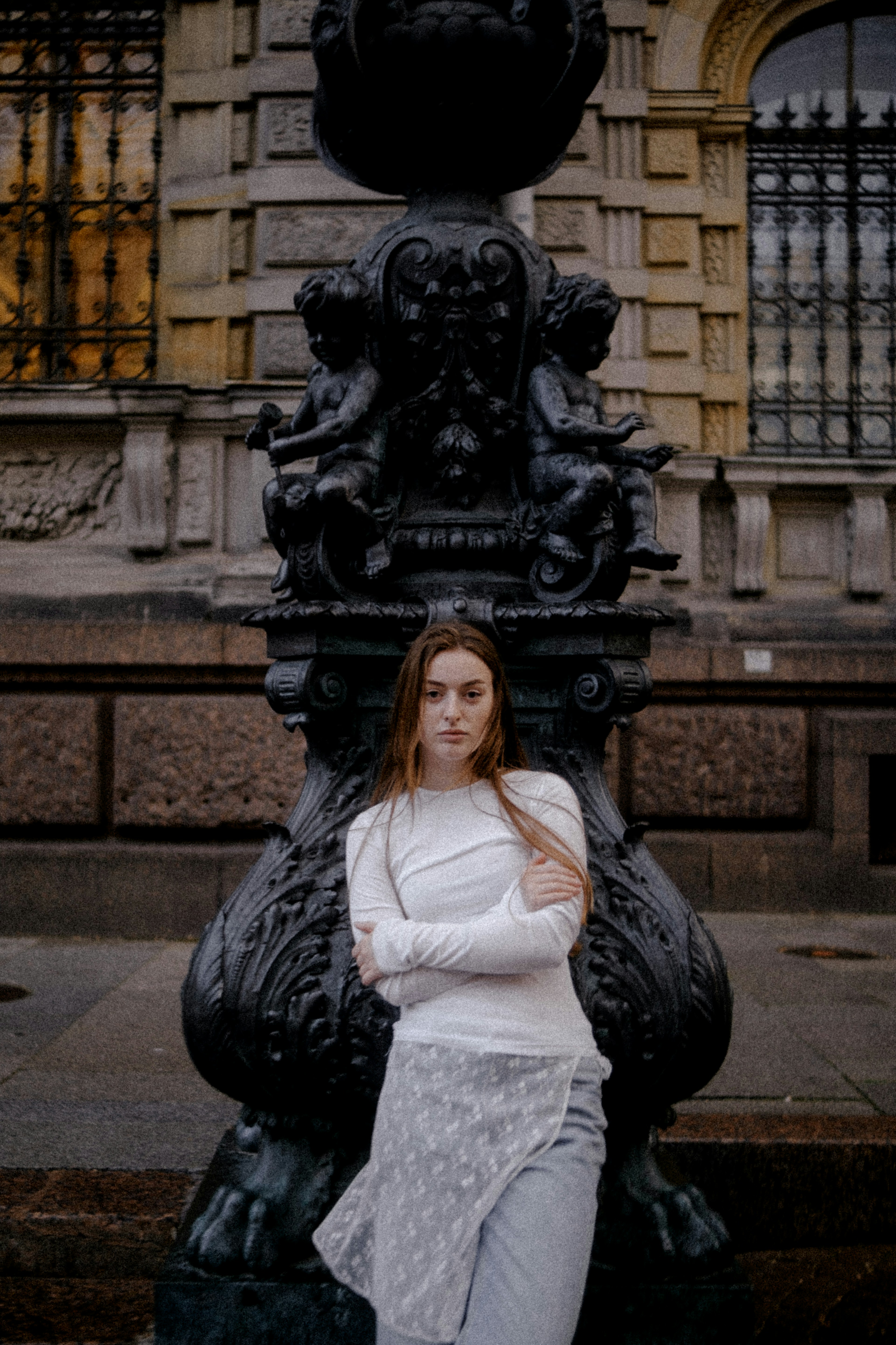 Whispers of Stone: Portrait Before a Cherub-Carved City Fountain