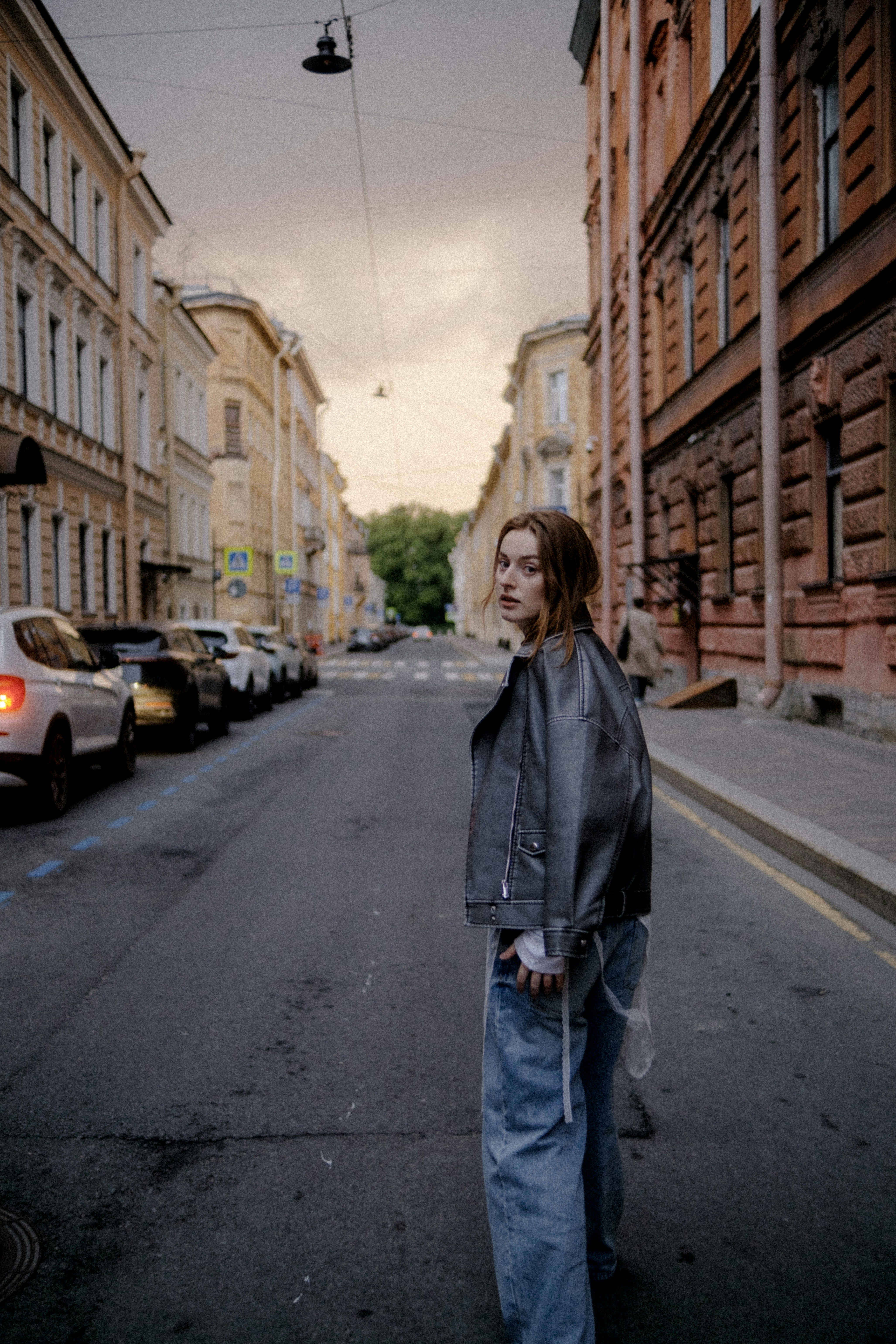 Dusk Gaze on a Quiet Street: A Denim Portrait in Warm Urban Light