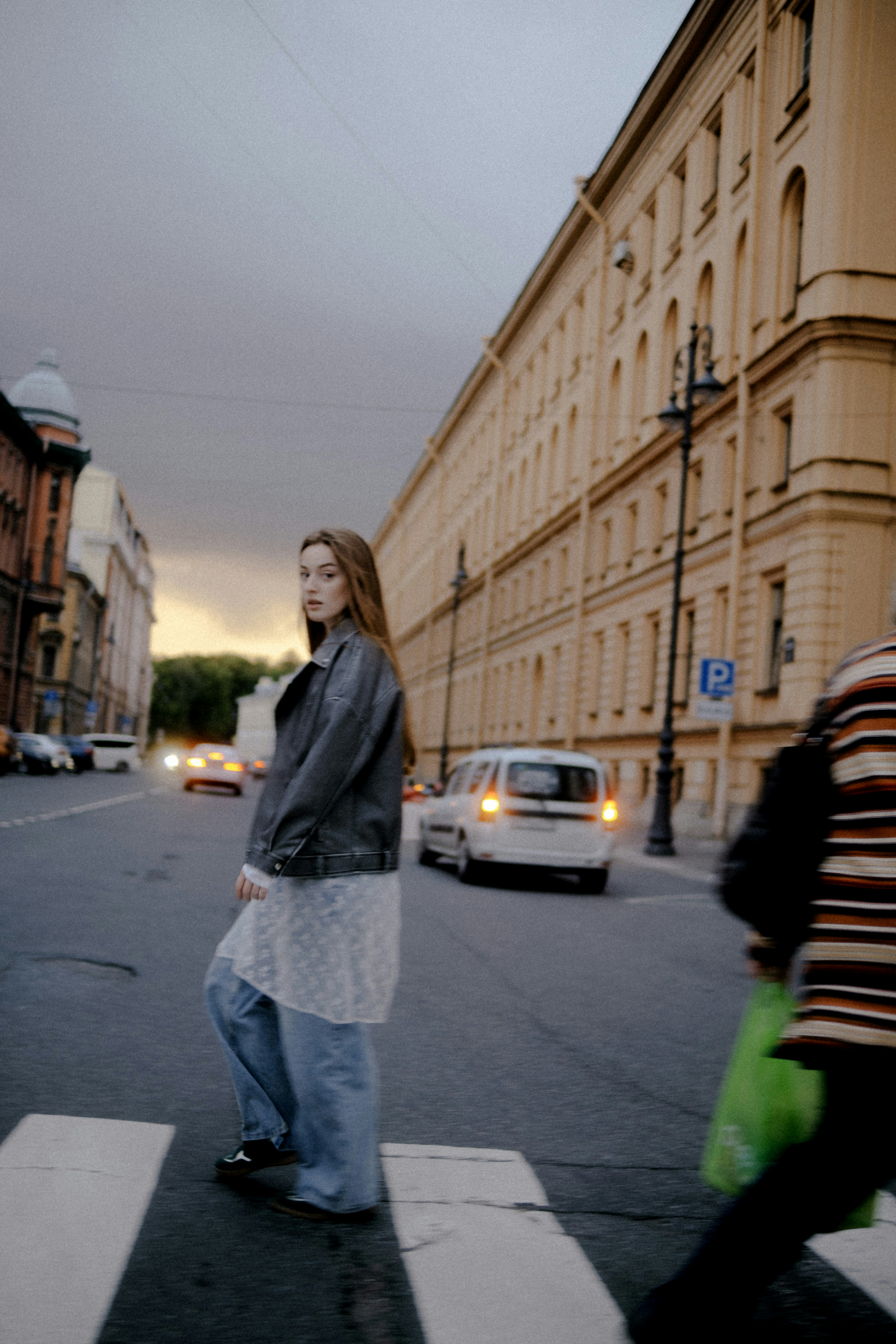 Denim at Dusk: Crossing the Quiet City Street
