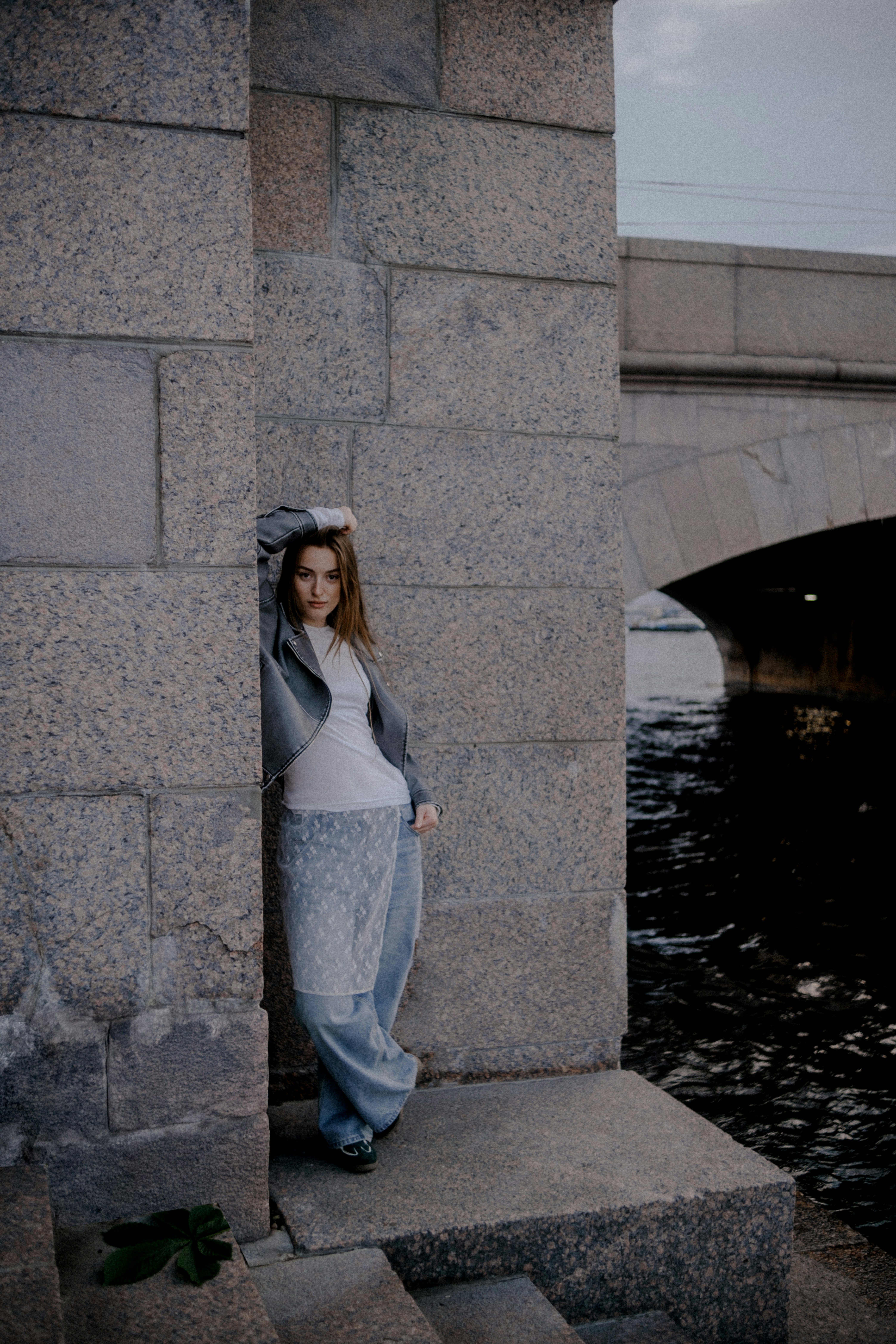 Granite Riverside Portrait: A Quiet Pause by the Stone Arch