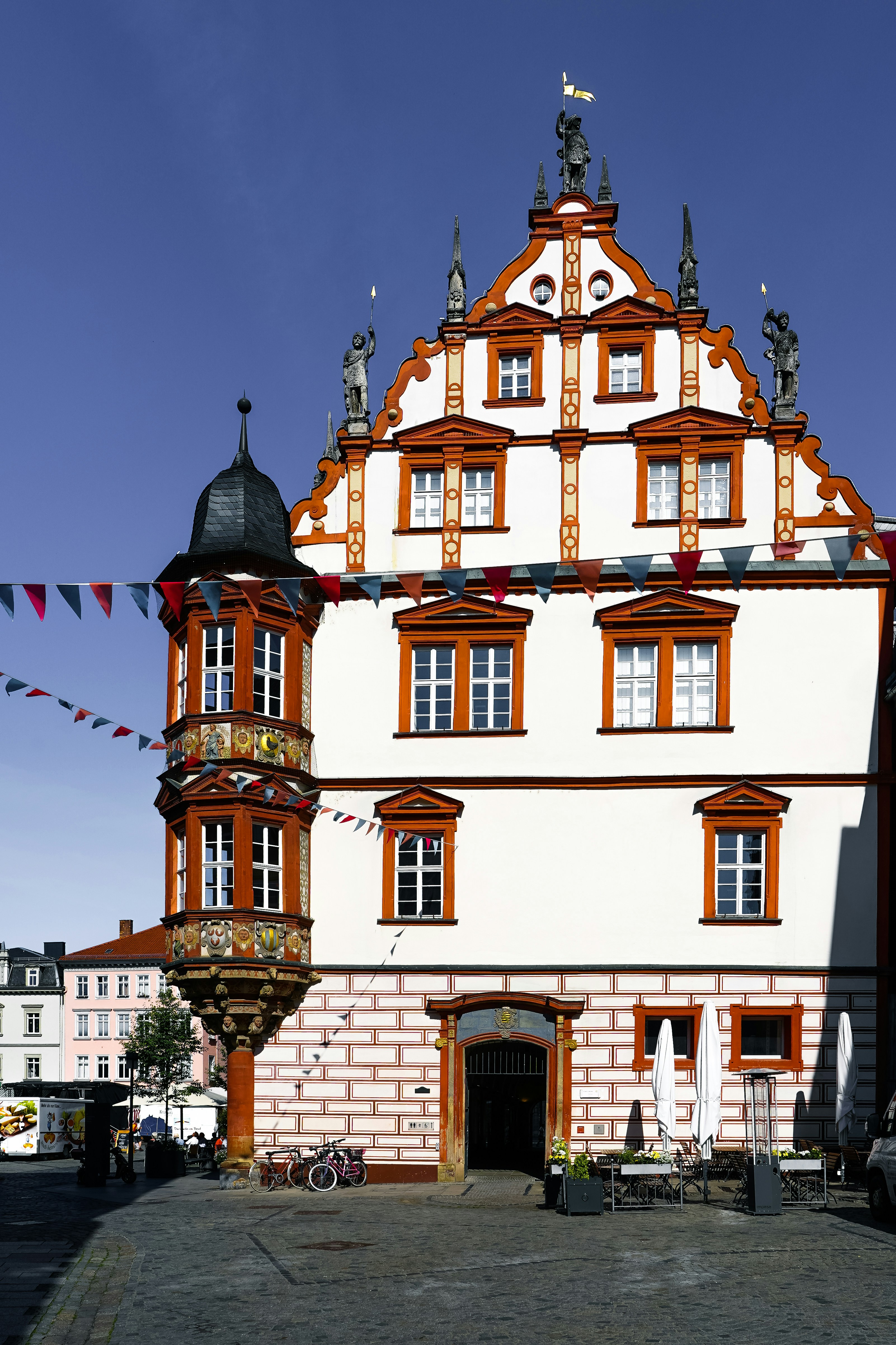 Festooned Facade: A Bright Baroque Town Hall Under Azure Skies