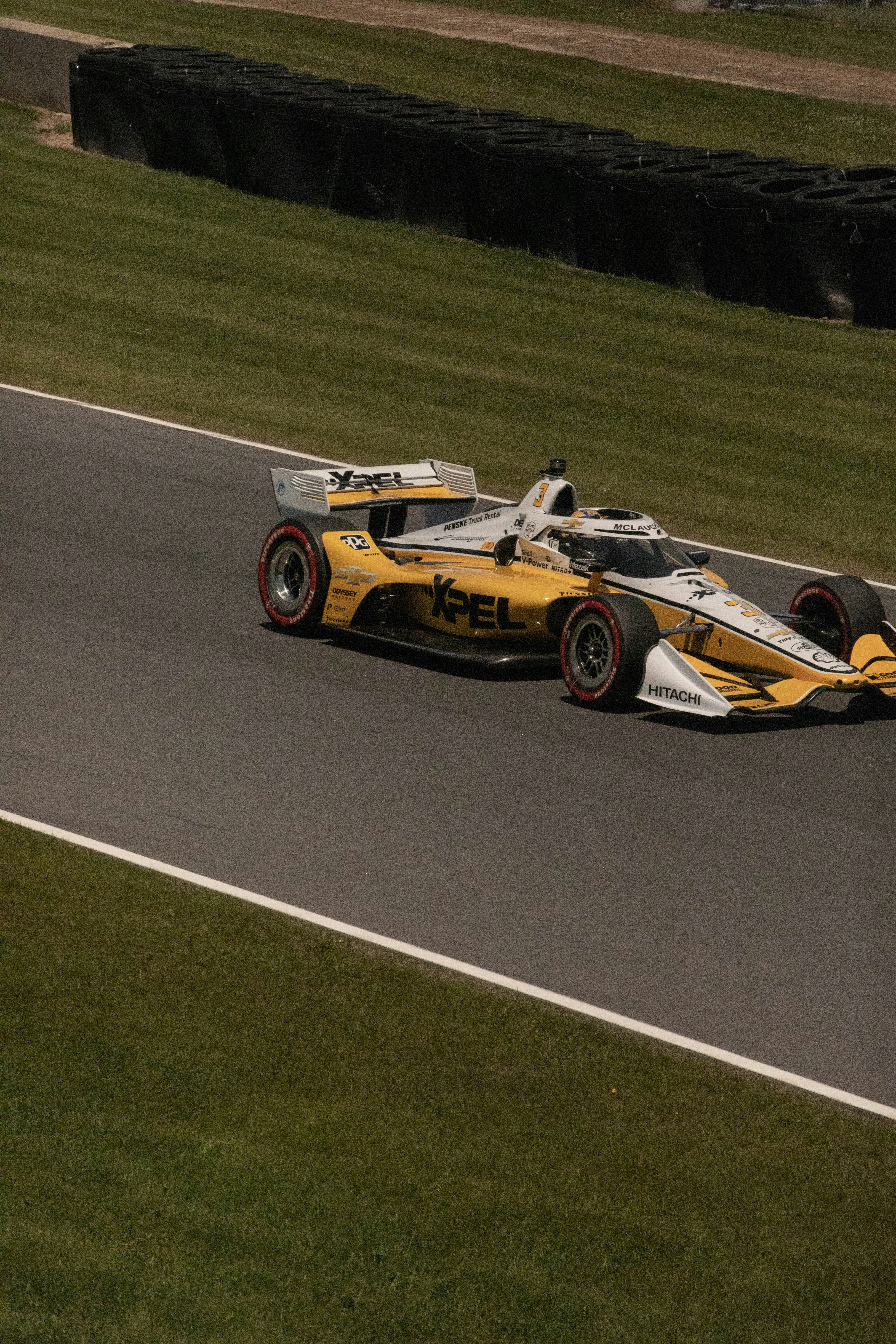 An indycar race car speeds around the track. photo – Free Wallpaper ...