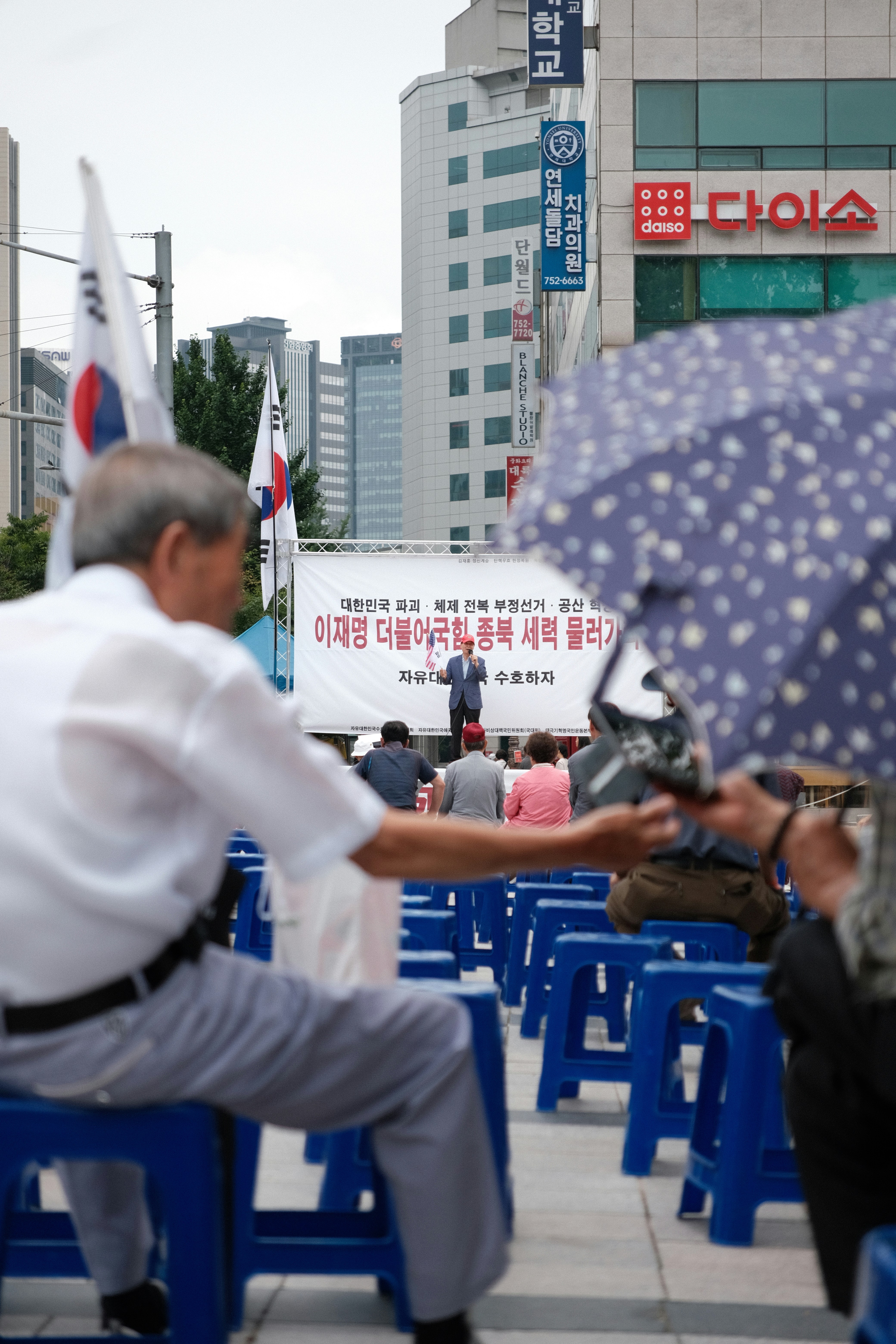 People are gathered to listen to a speaker.