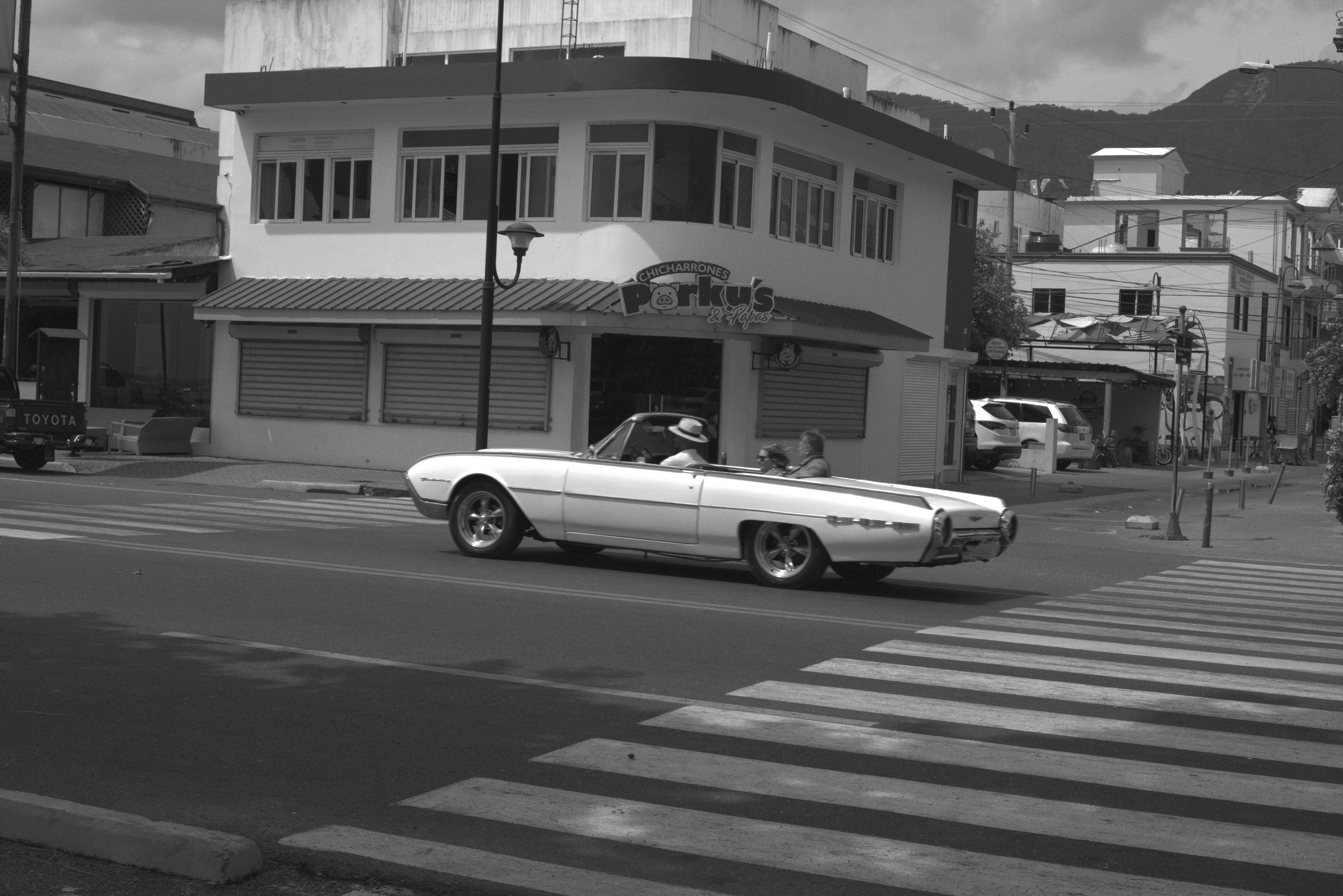 Cruising Through Time: A Classic Ride in Urban Serenity