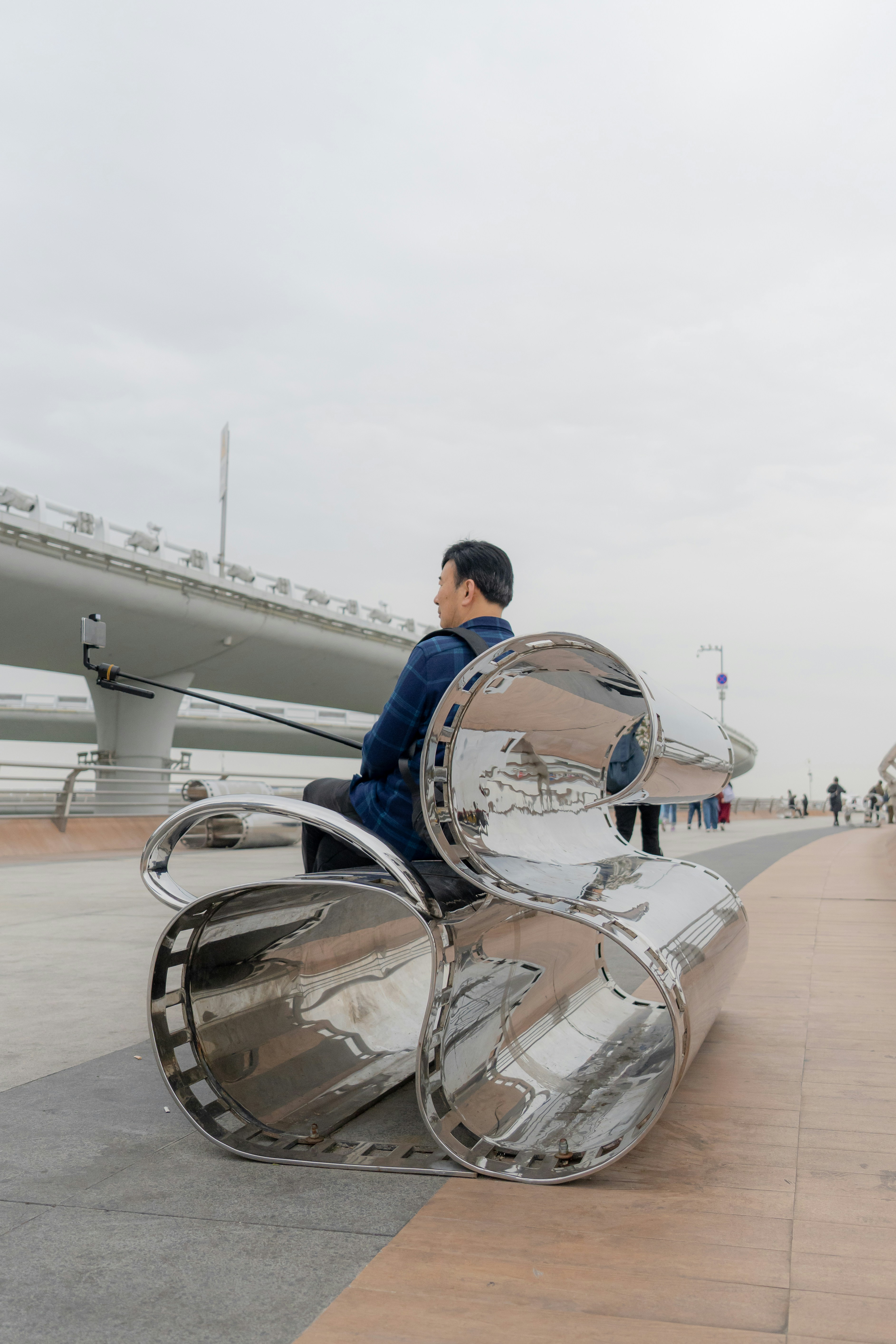 Chrome-Coiled Bench Moment by the Waterfront Promenade