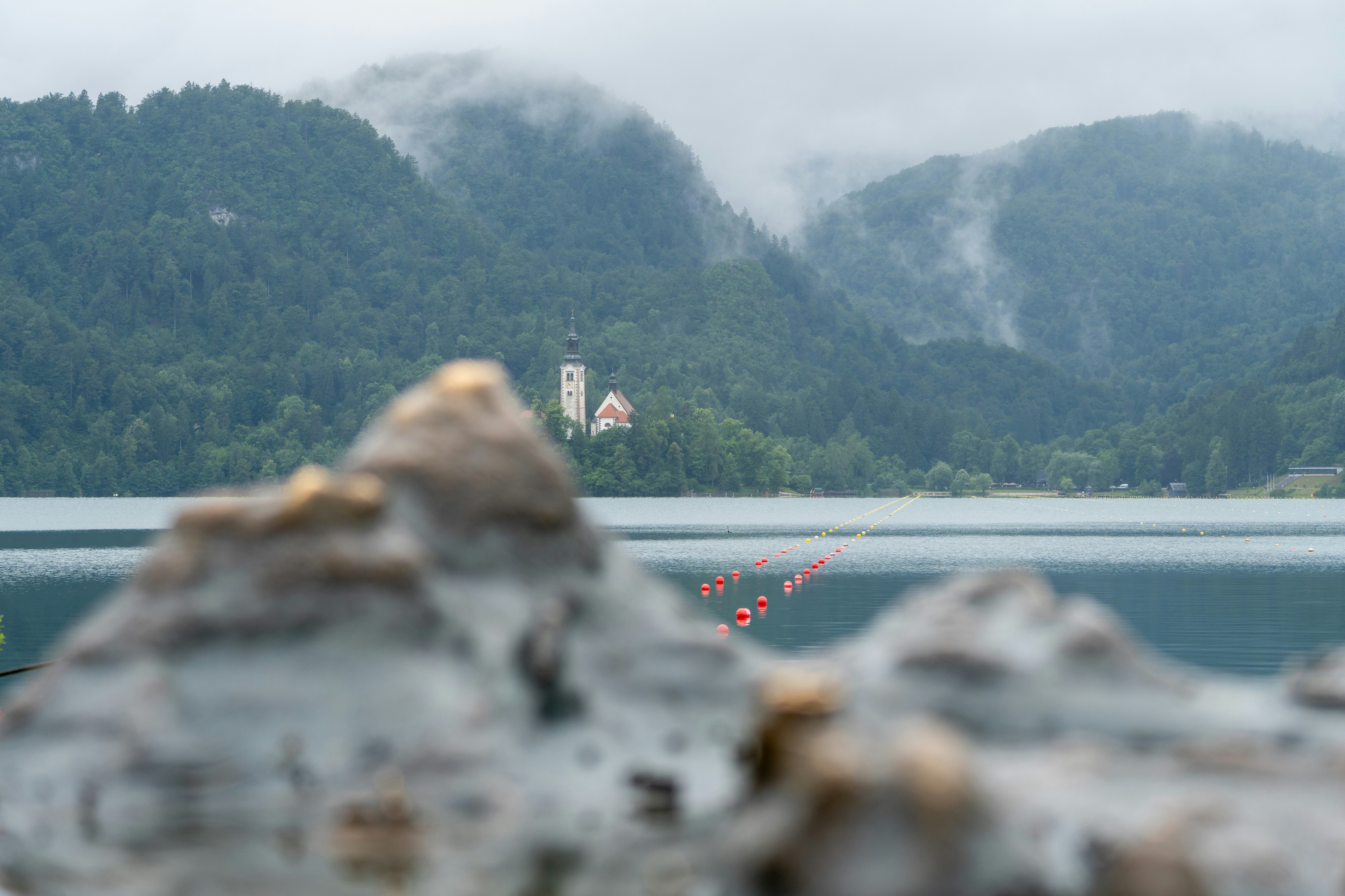 Misty Alps Retreat Across a Calm Lake
