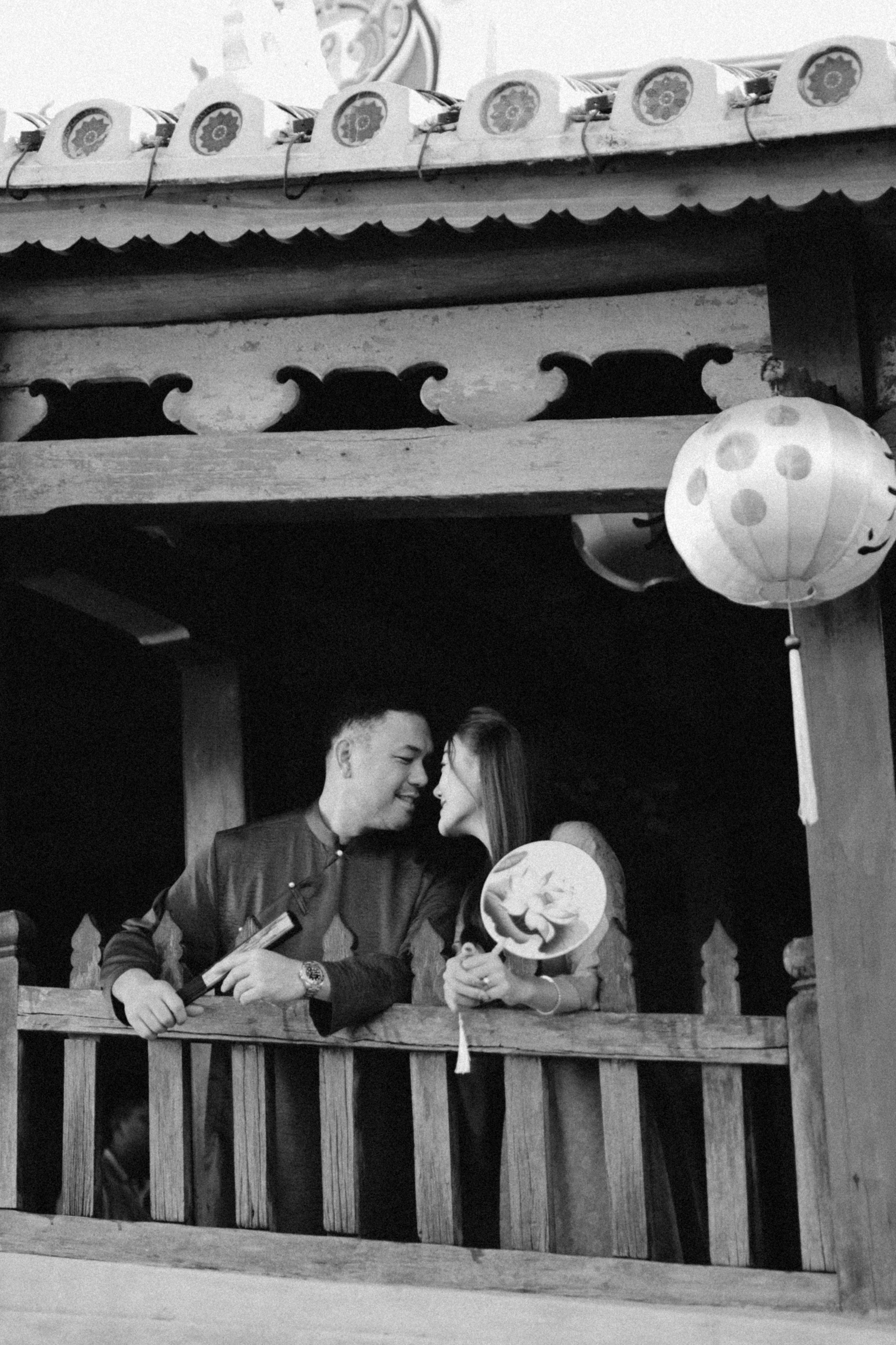 Couple shares an intimate moment in an ornate structure. photo – Free ...