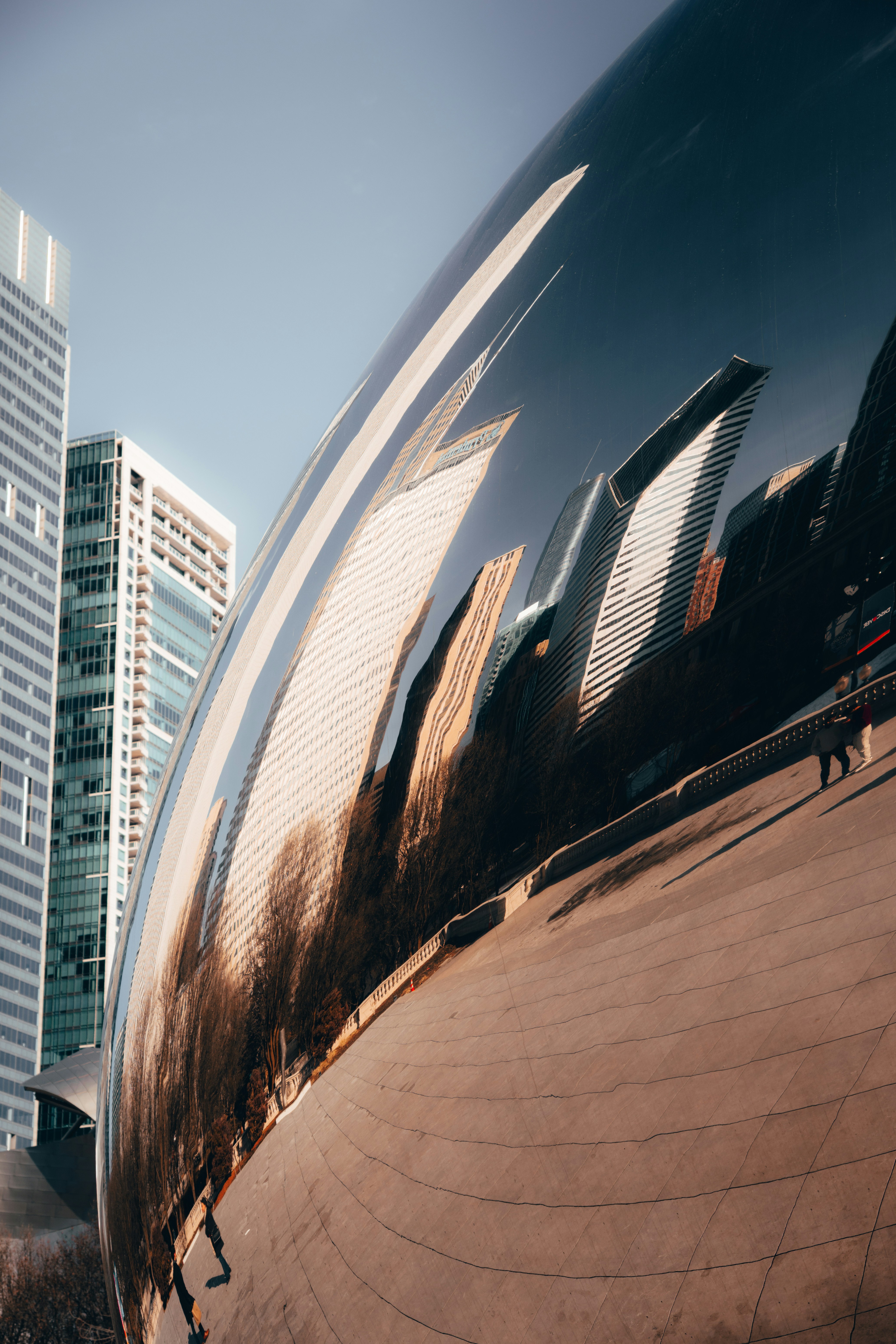 Urban Reflections: A Metallic Canvas of City Life