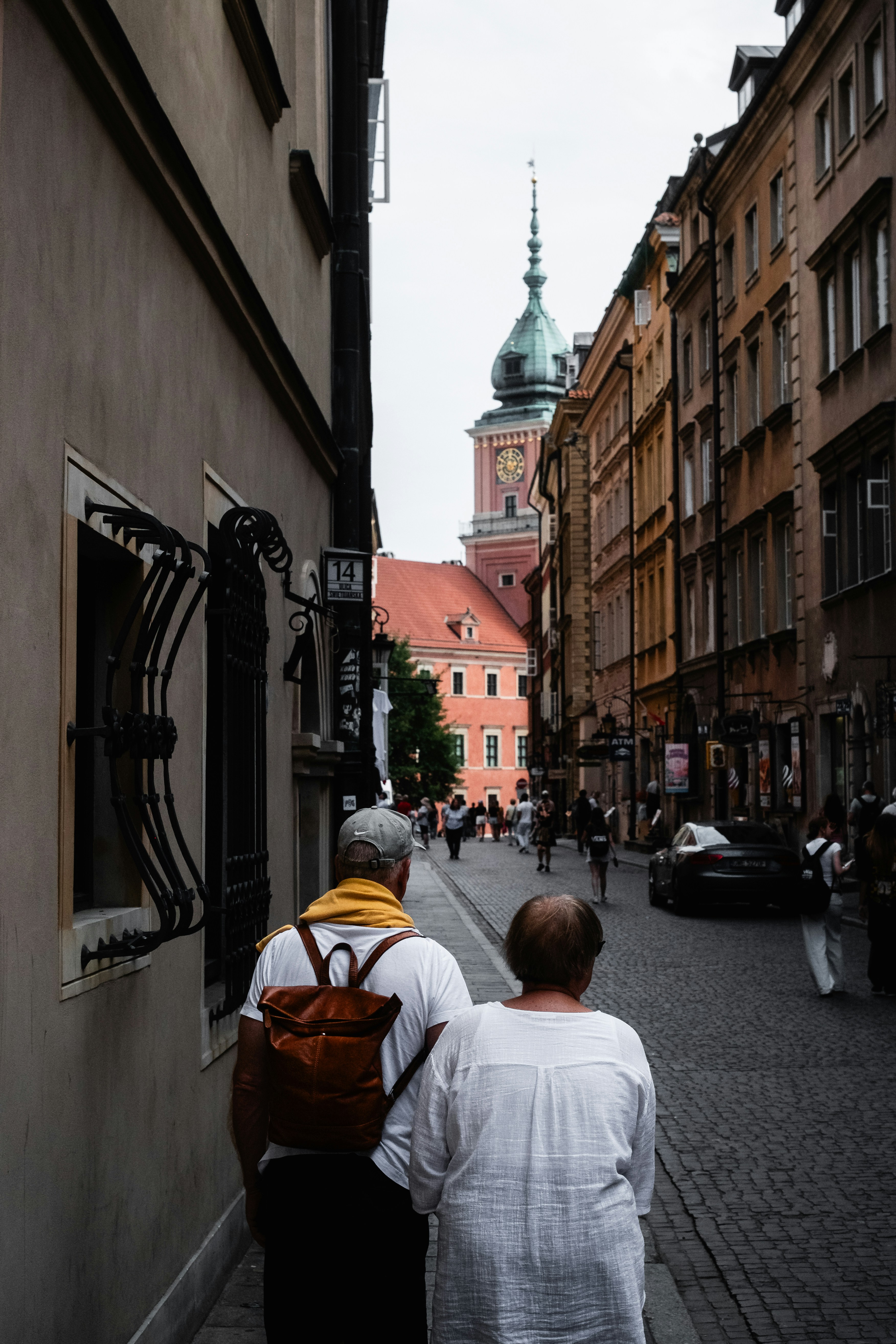 Clocktower Corridor: Cobblestones Toward a Green-Domed Spire