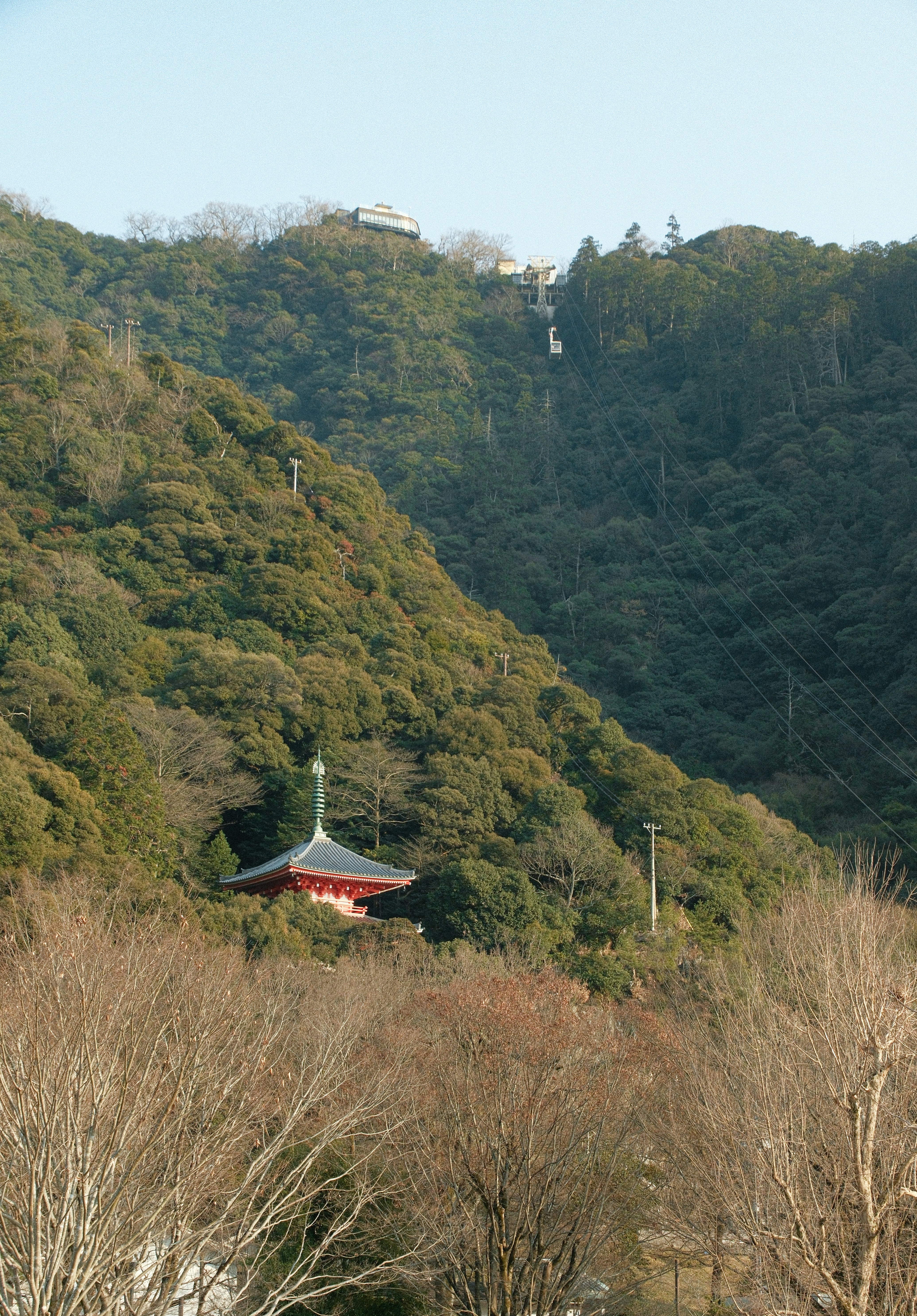 Crimson Pagoda Nestled in a Quiet Forested Slope