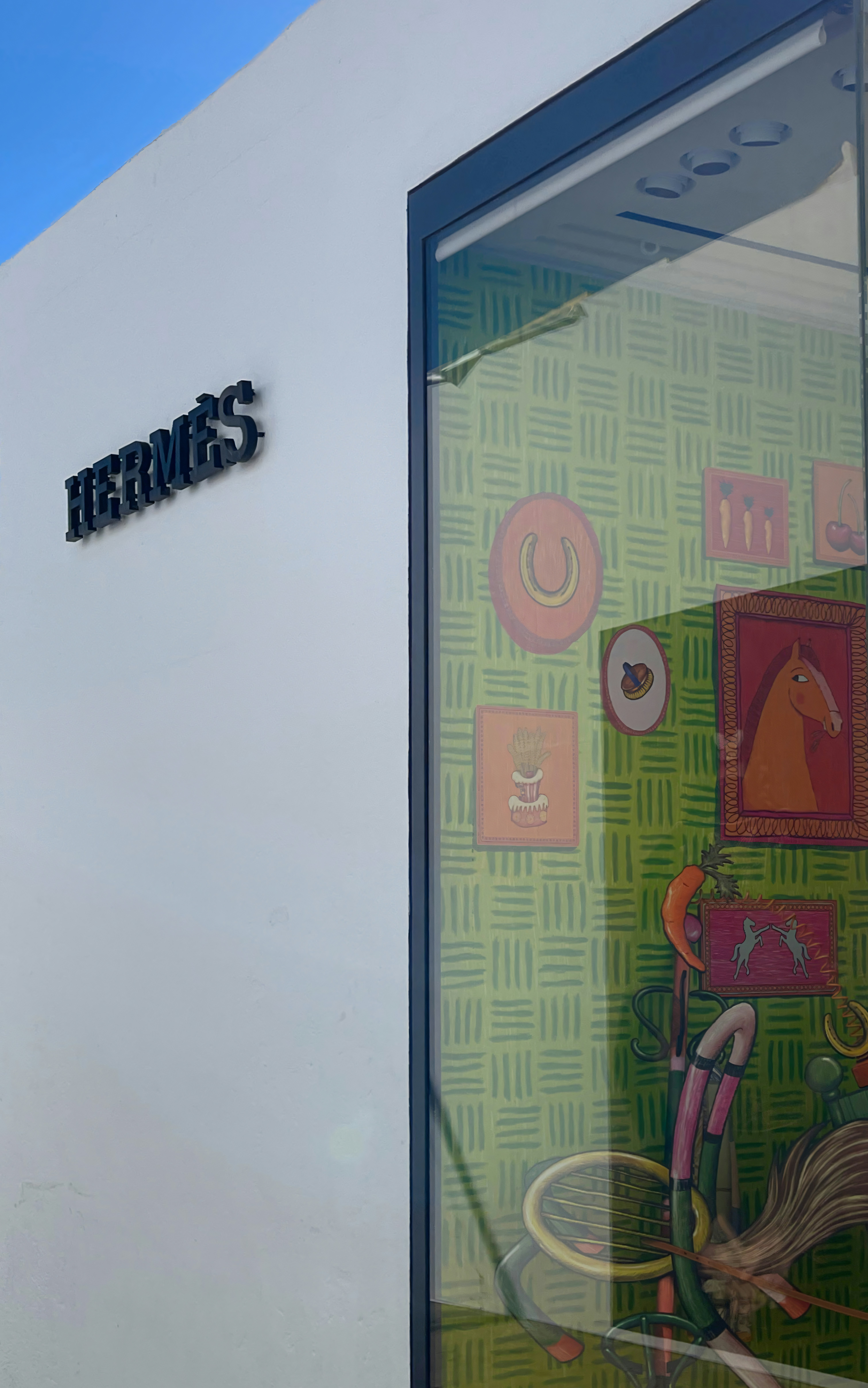 Hermès store with a colorful window display. photo – Free Art Image on ...