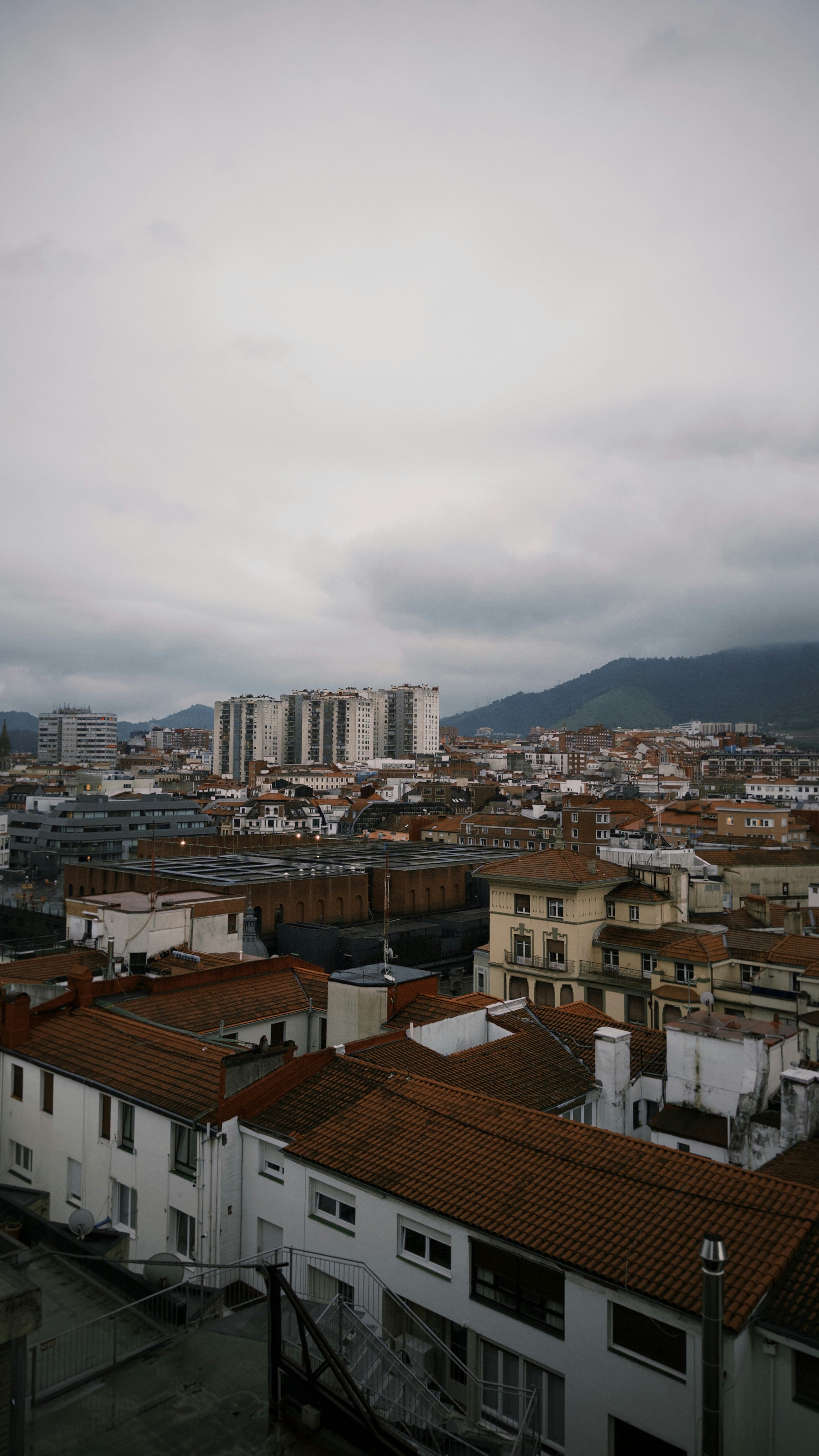 Cityscape view under a cloudy sky.