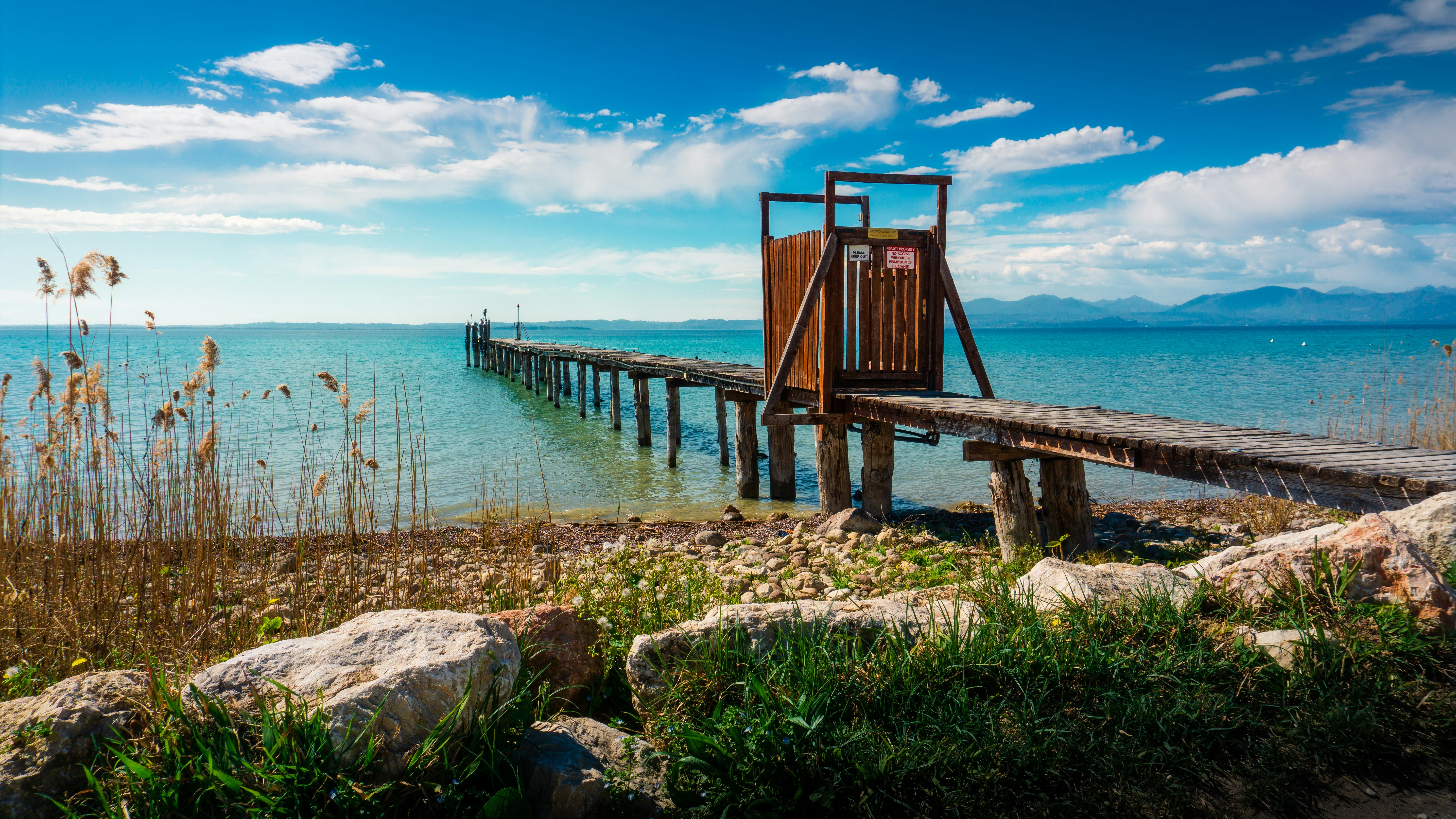 Azure Pier: A Wooden Walkway Reaching the Quiet Horizon