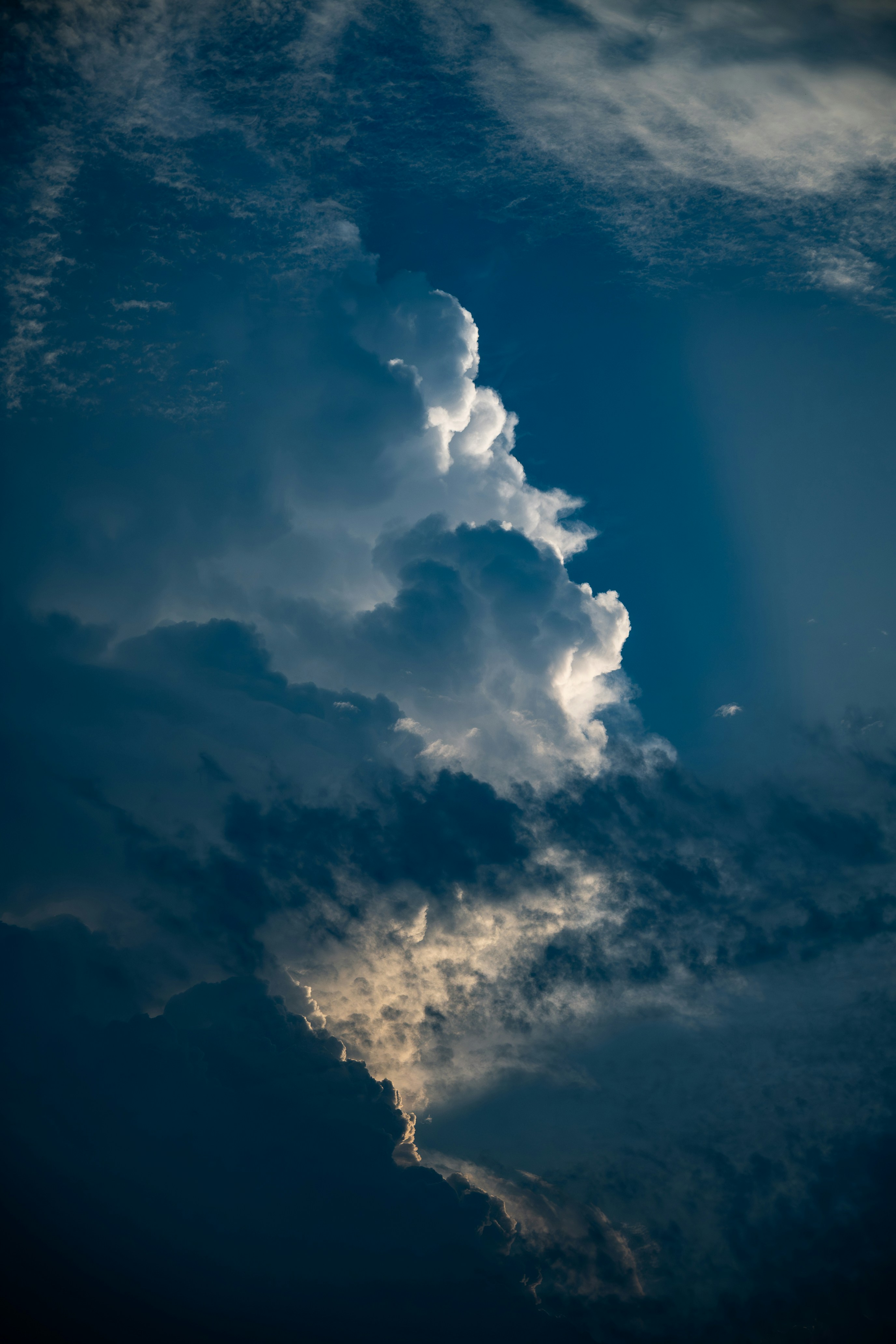 Dramatic clouds float across a bright blue sky. photo – Free Sunset ...