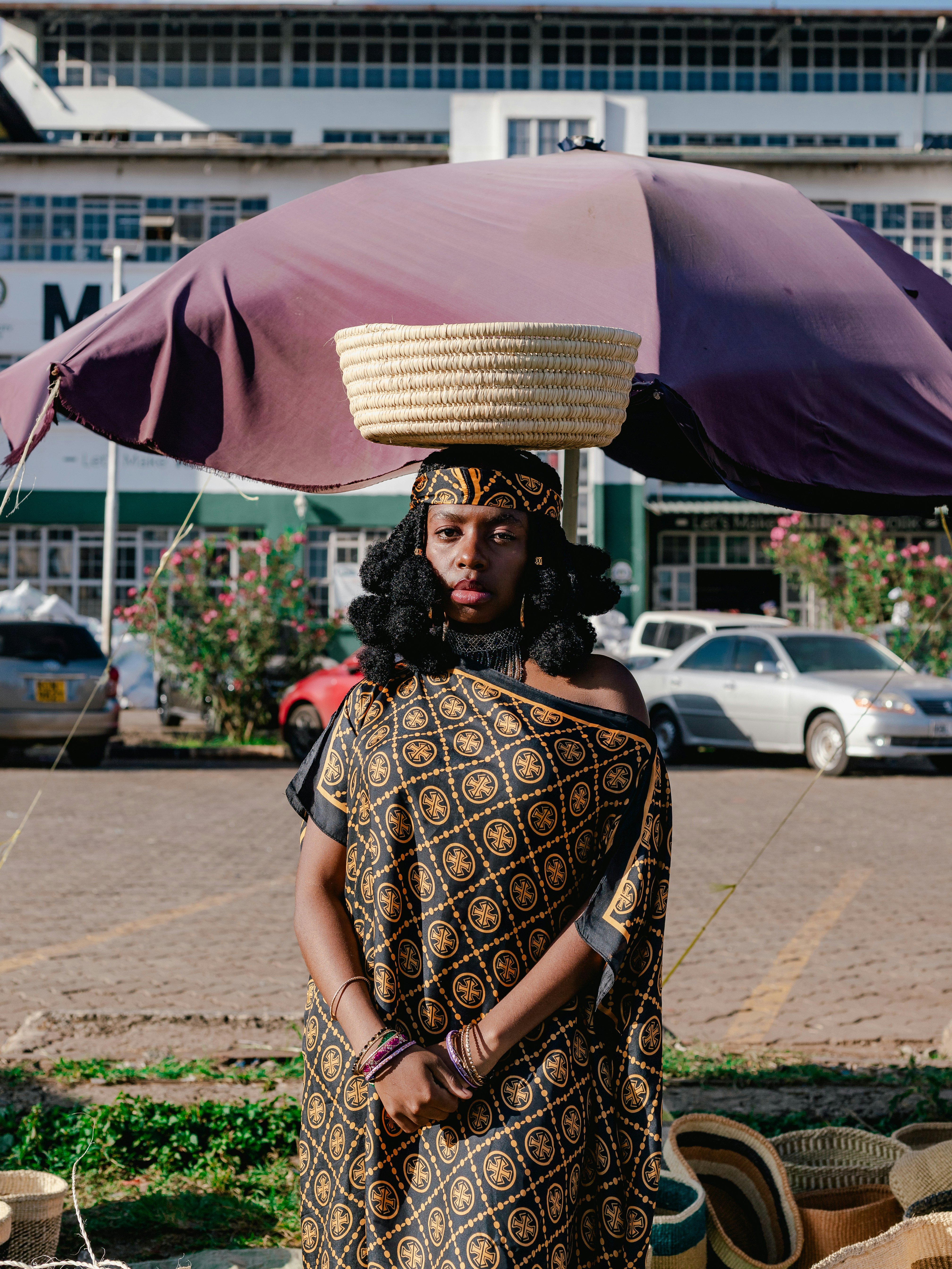 Straw Crown Portrait Under a Purple Market Canopy