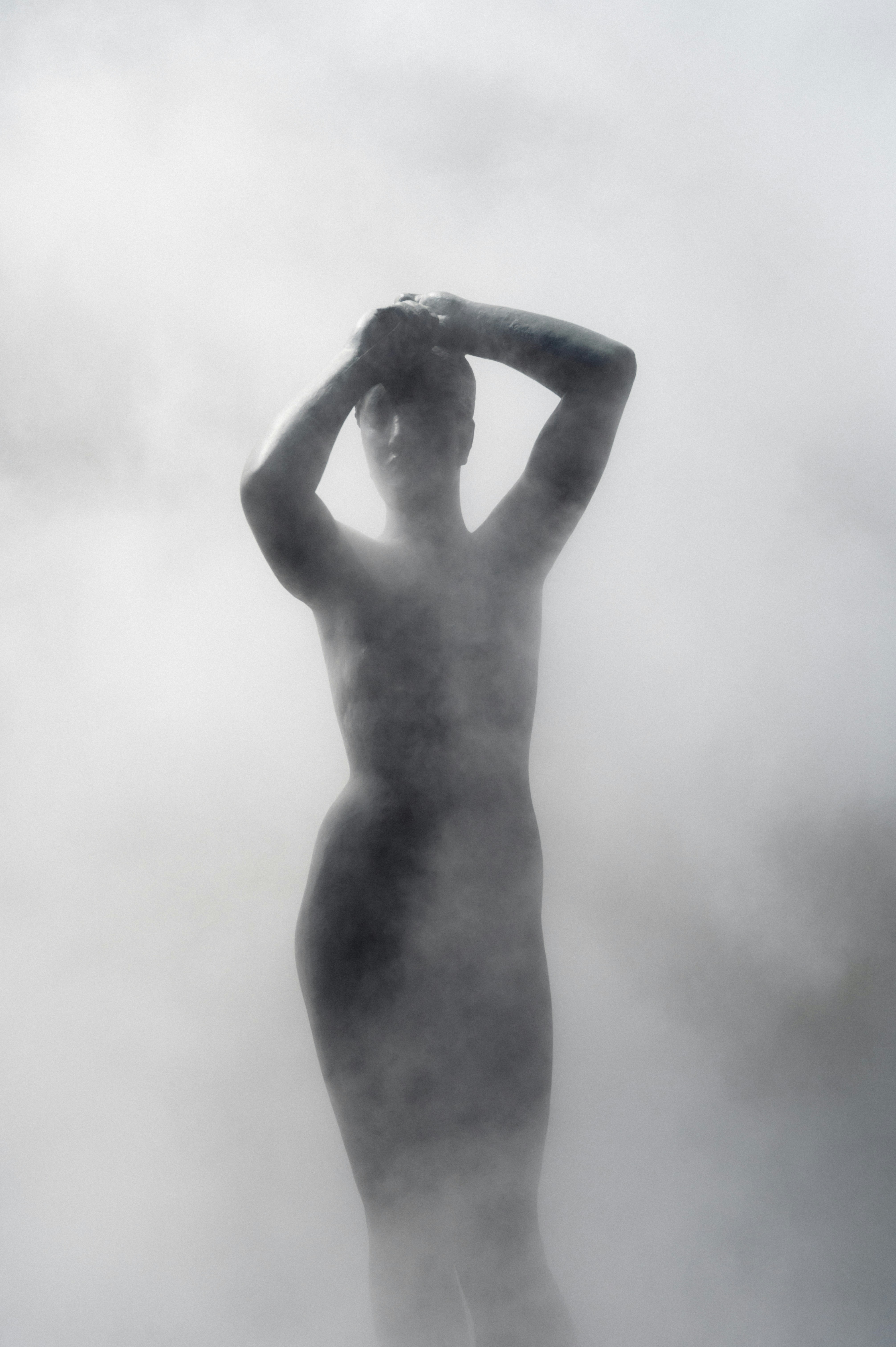Veiled Silhouette in Ethereal Mist
