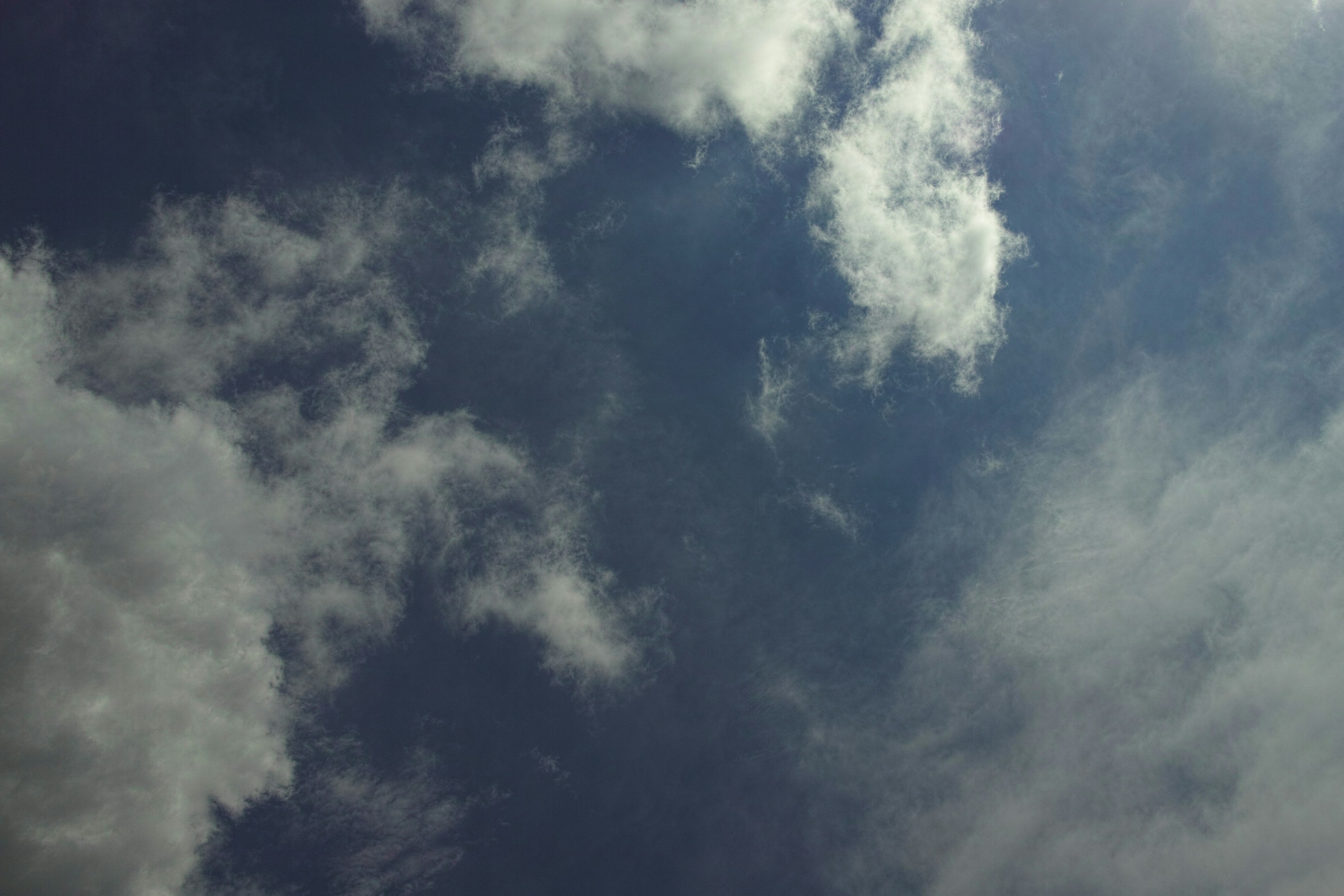 sky background | White clouds drift across a blue sky.