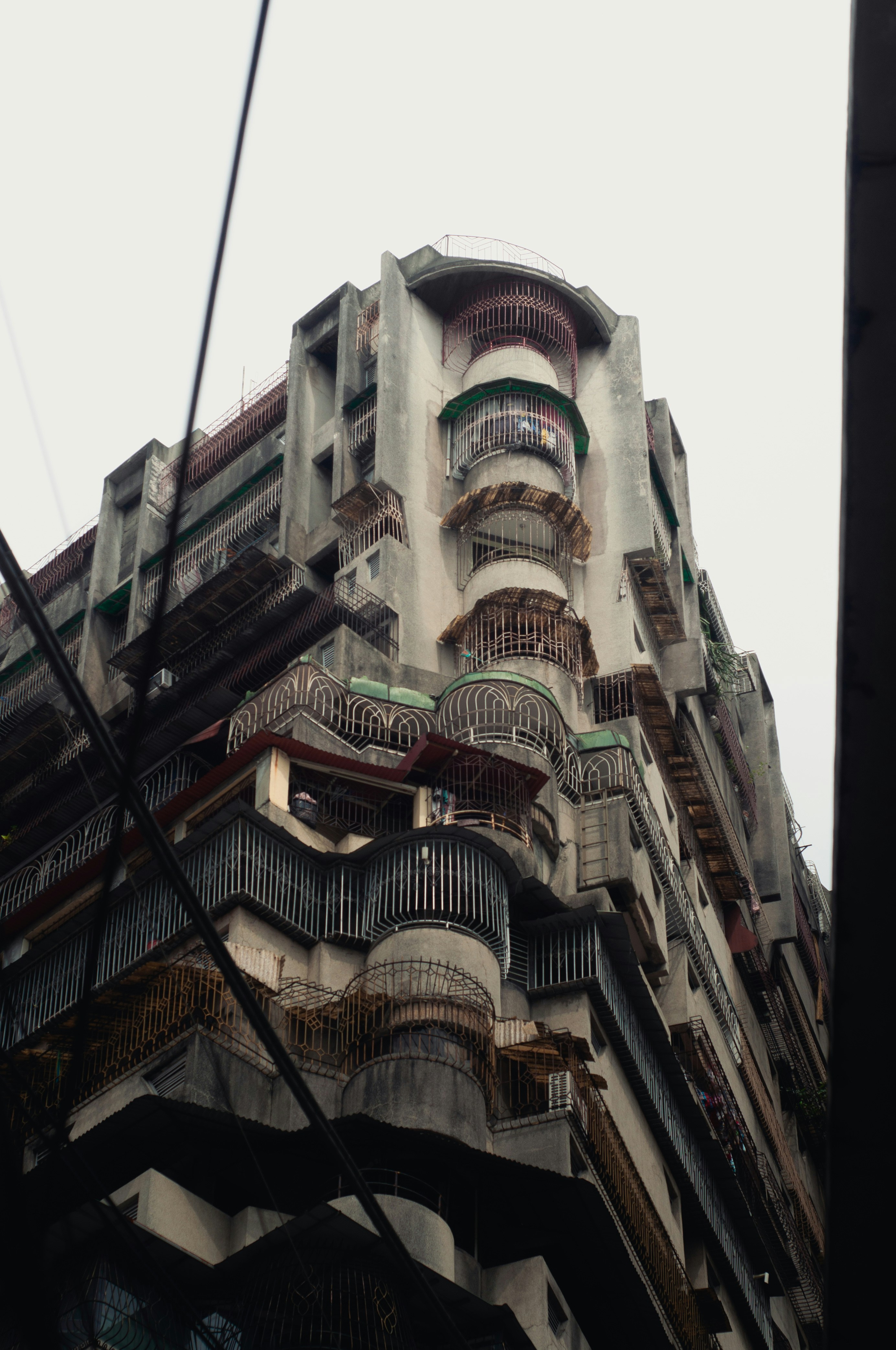 An old building stands against a gloomy sky.