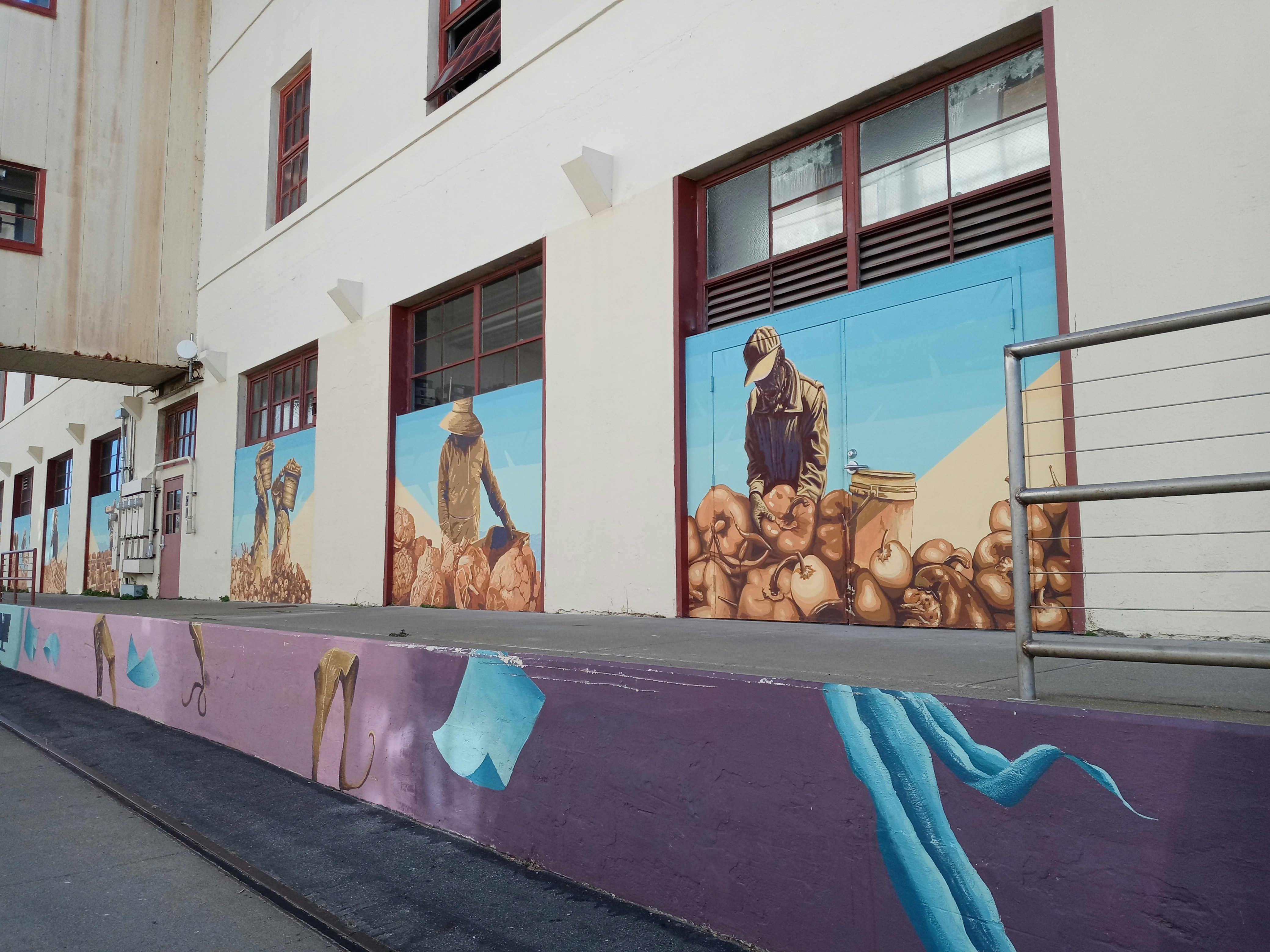 Building facade with unique and colorful murals.