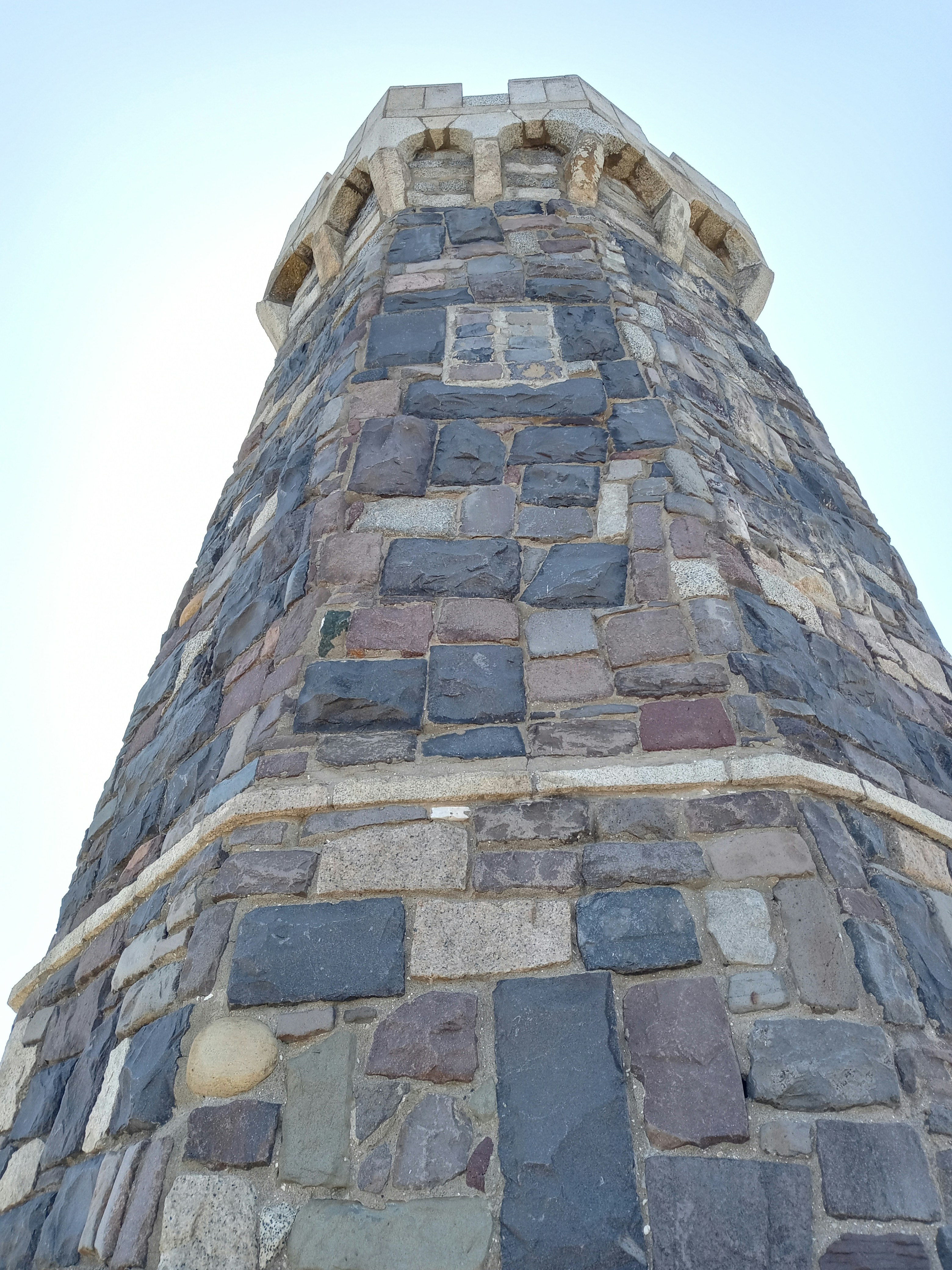 A tall stone tower reaches towards the sky.