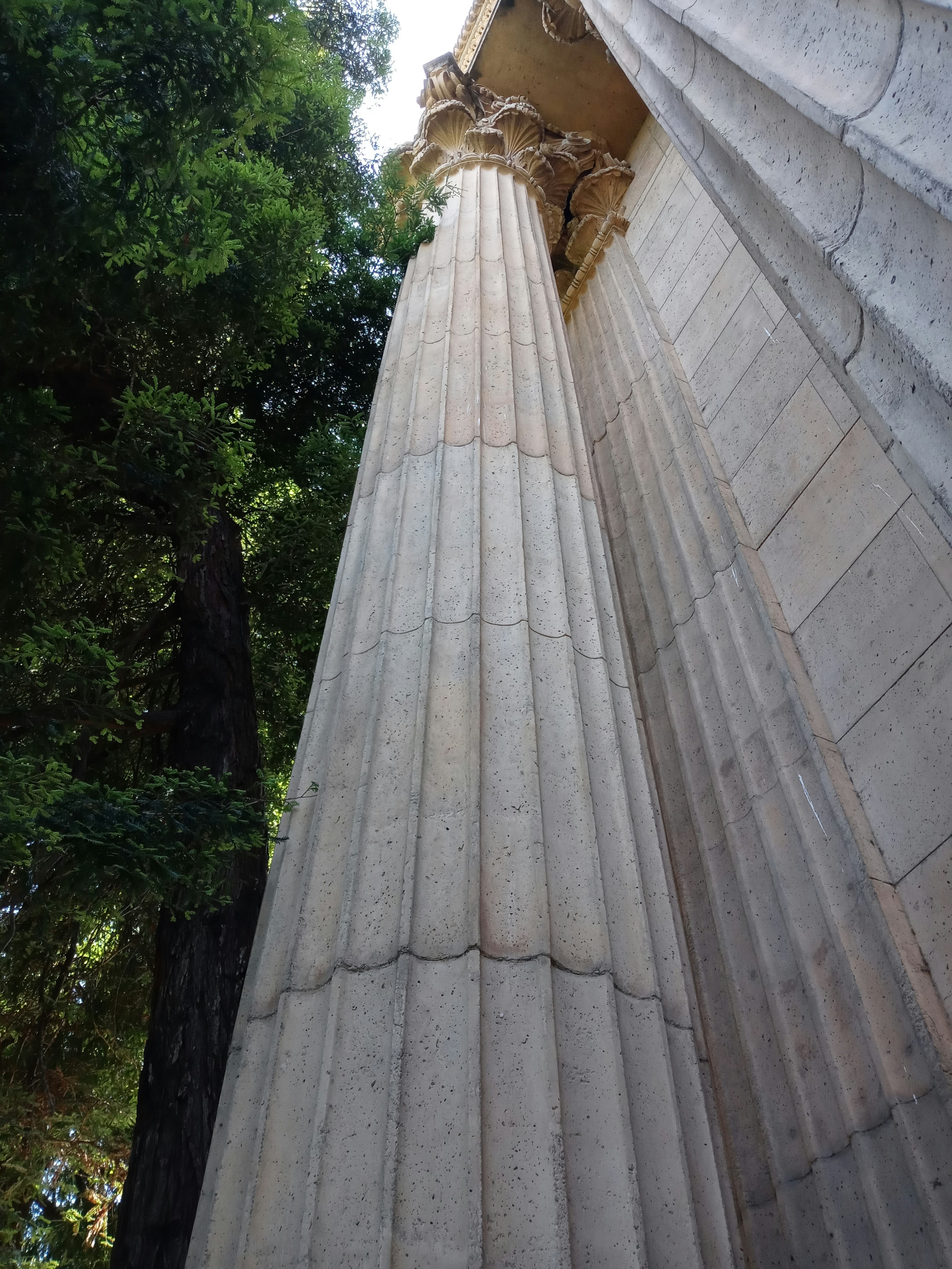 Palace of Fine Arts | Tall, ornate pillars reach towards the sky.