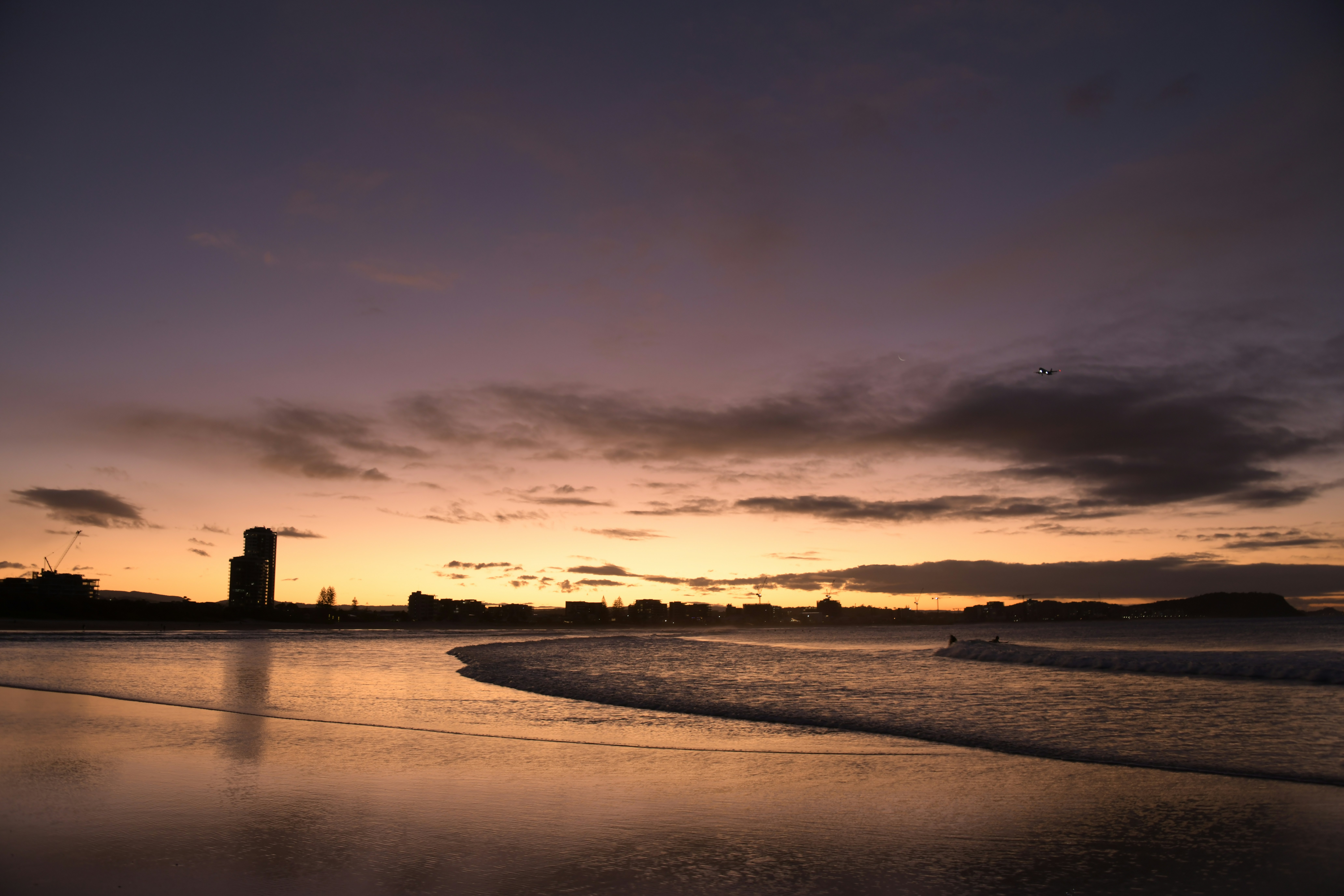 Twilight on the Tide: Curved Shore and Quiet Skyline