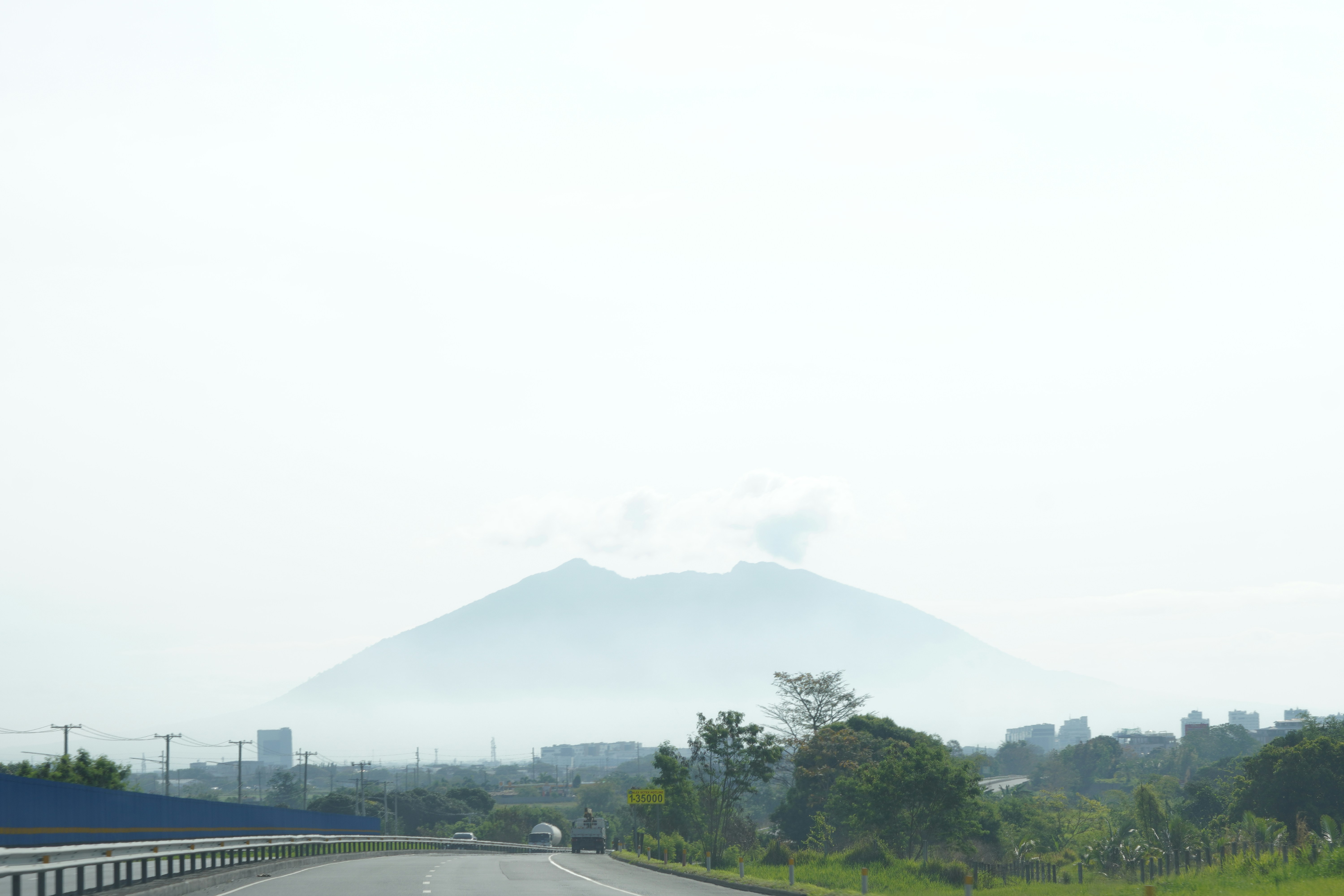 Veil of Mist Over Majestic Peaks