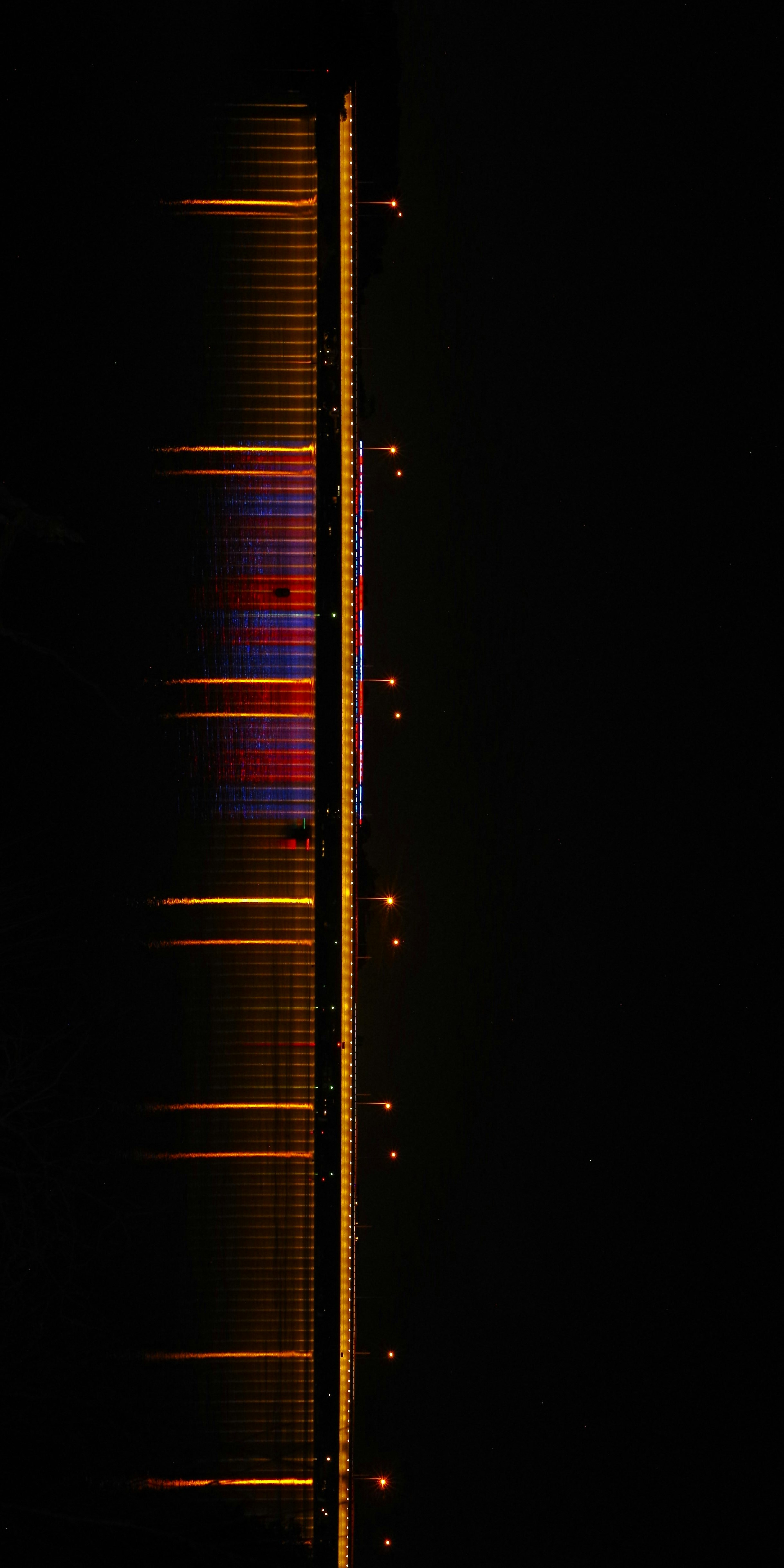 Neon Reflections: The Bridge's Light Dance