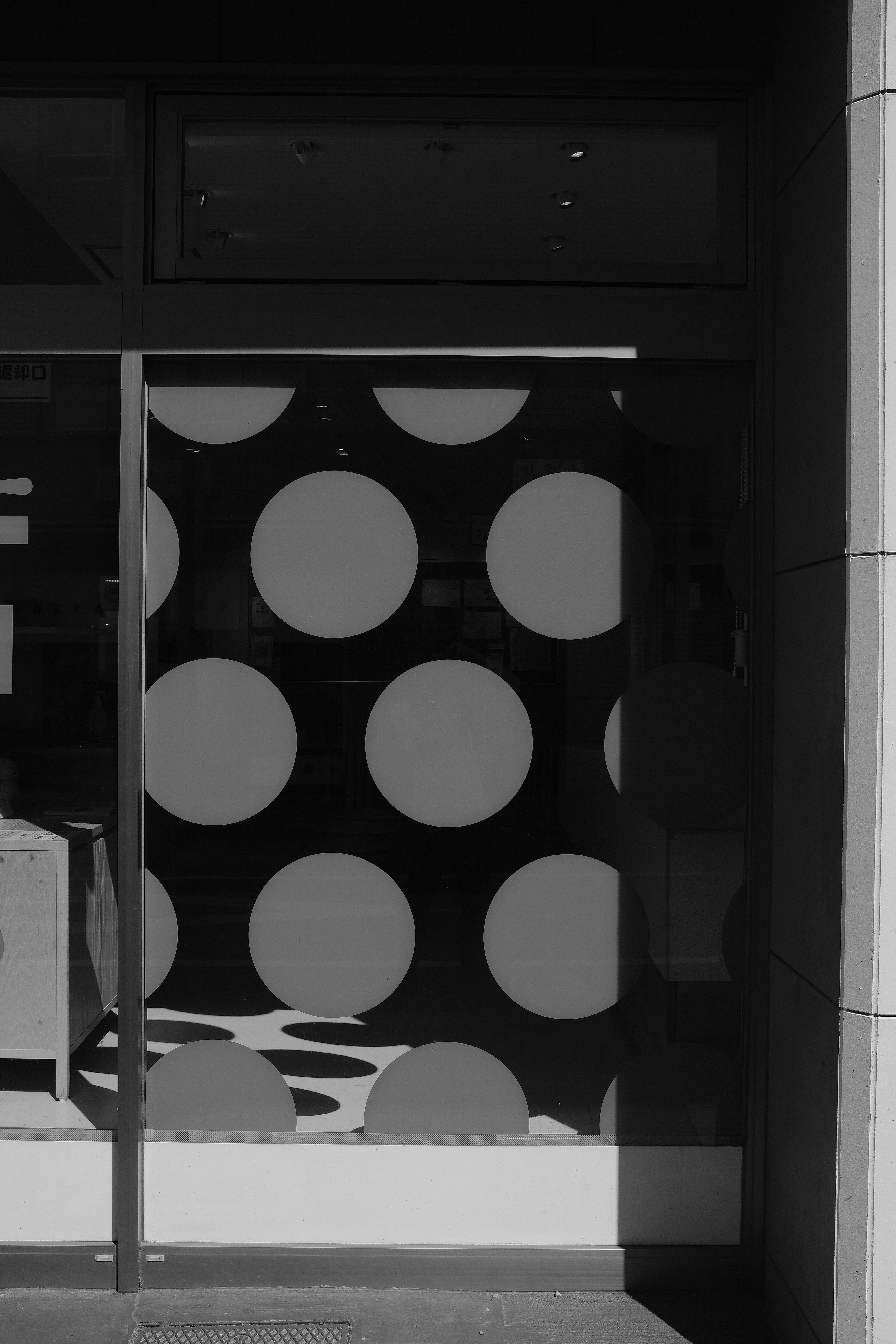 Window decorated with large, circular white spots. photo – Free Image ...