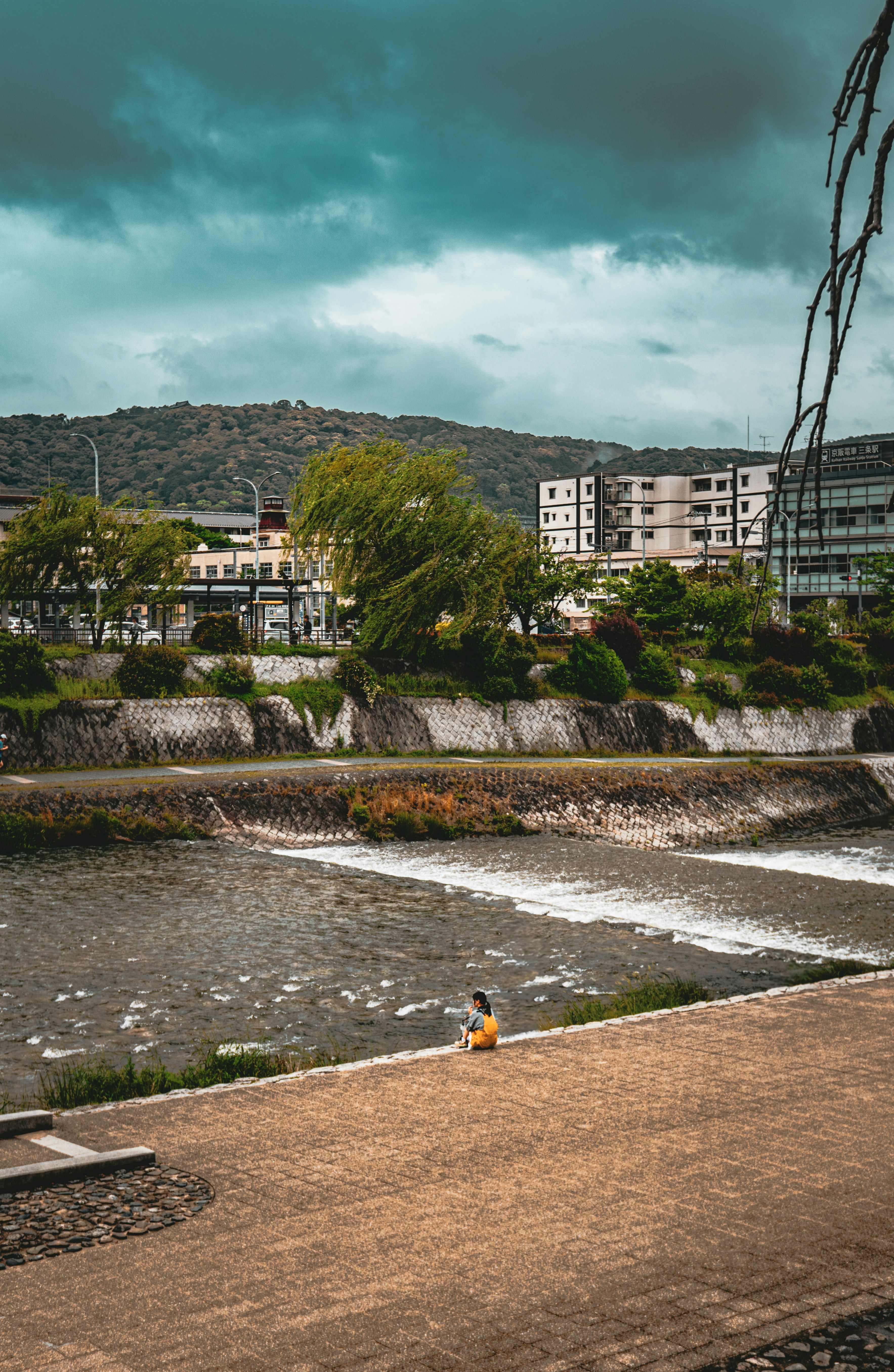 Reflections by the Riverside: A Moment of Solitude
