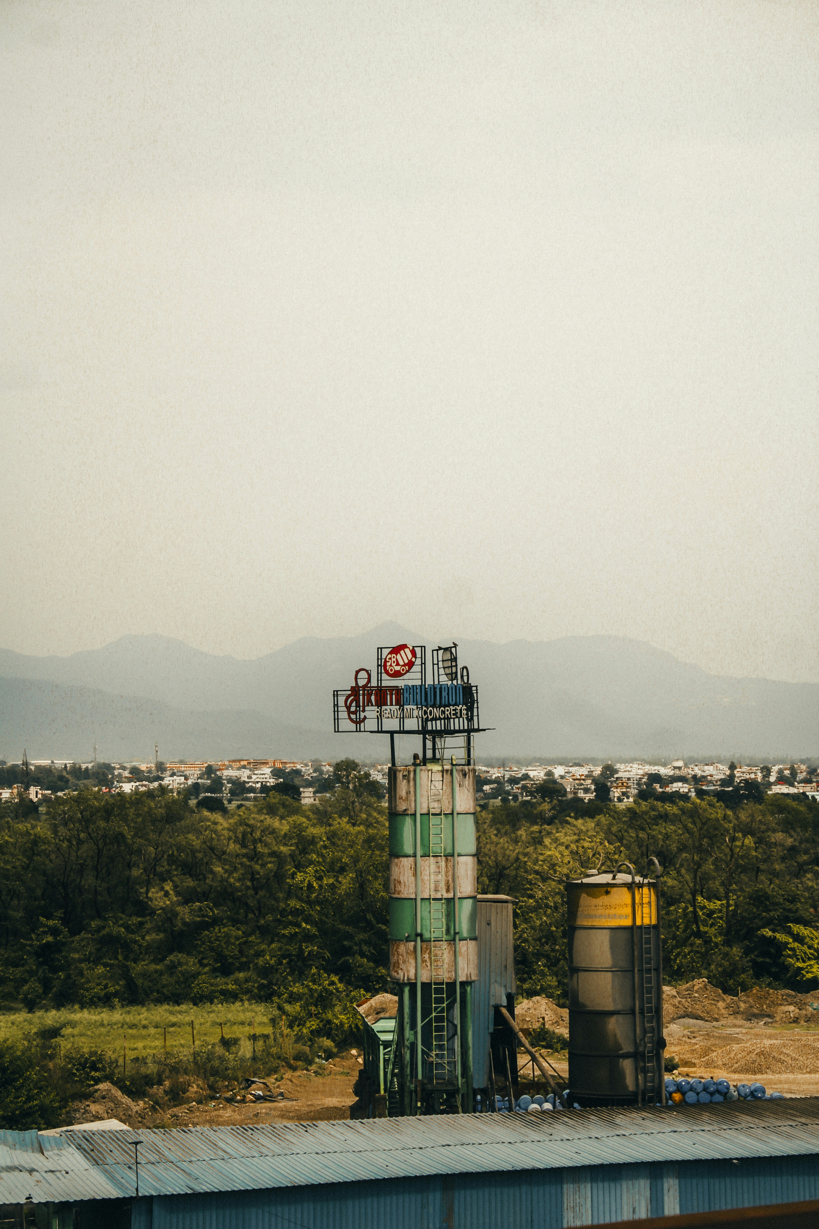 Industrial Echoes Against Nature's Backdrop