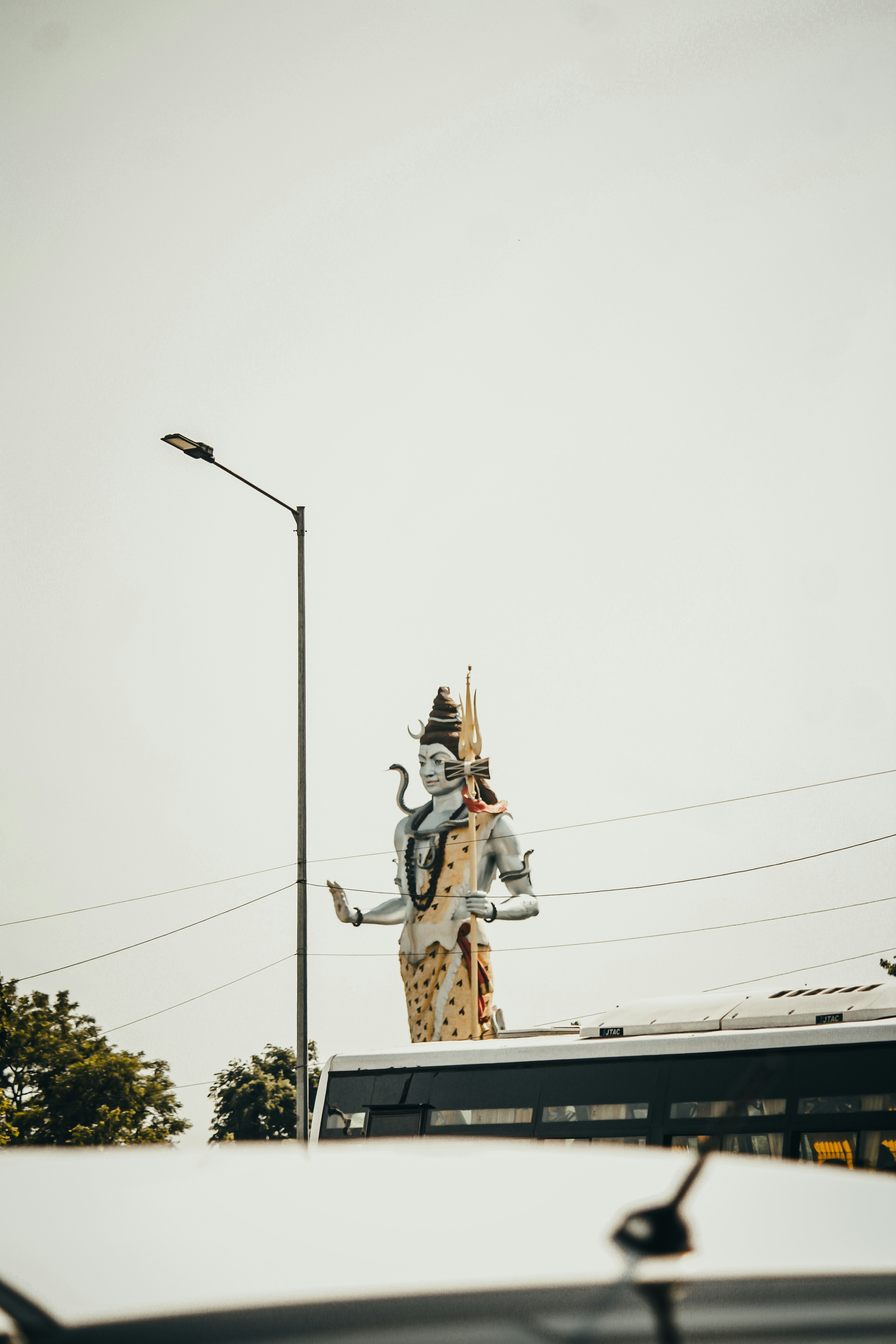A tall statue of a hindu deity.