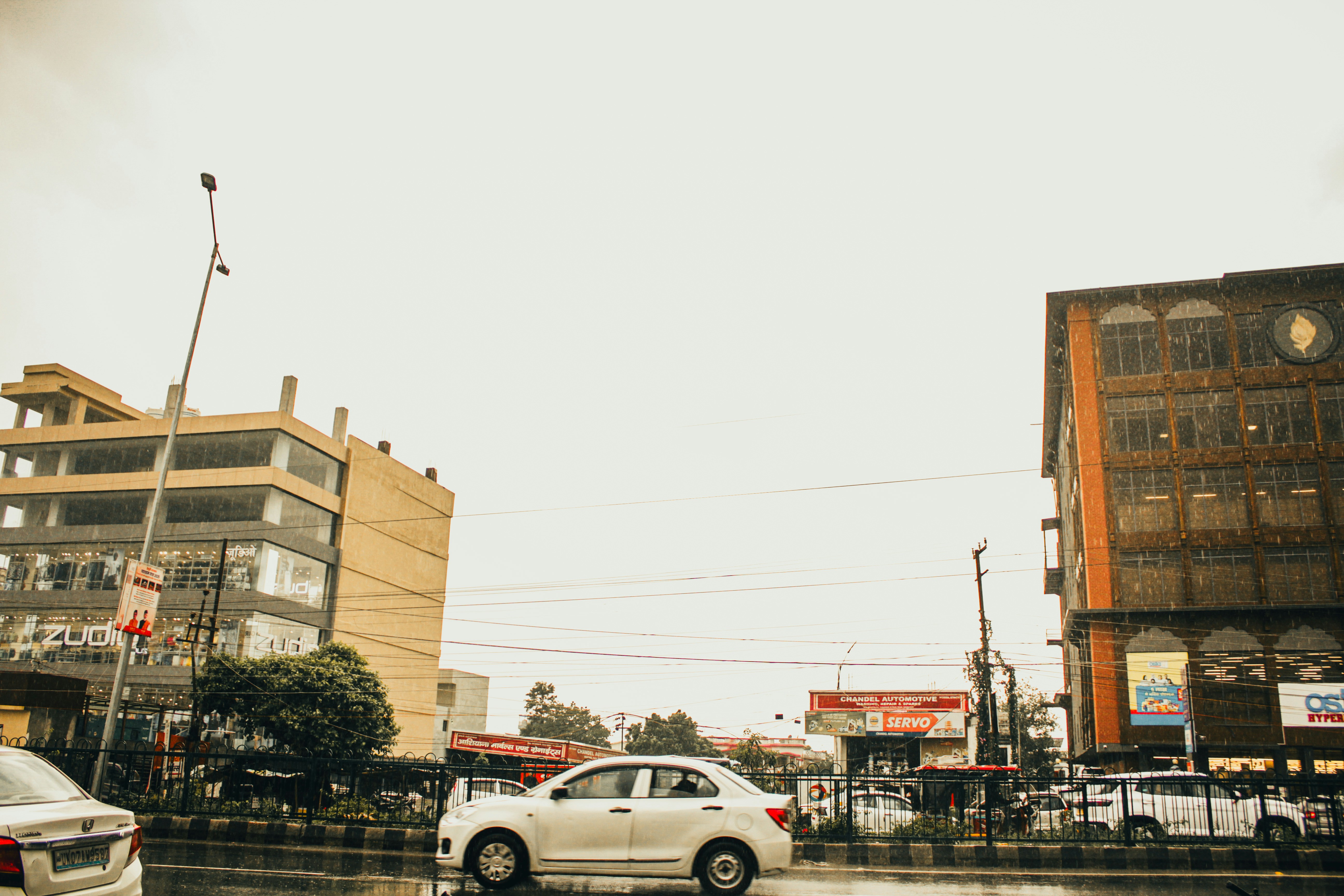 A city street is seen on a cloudy day.