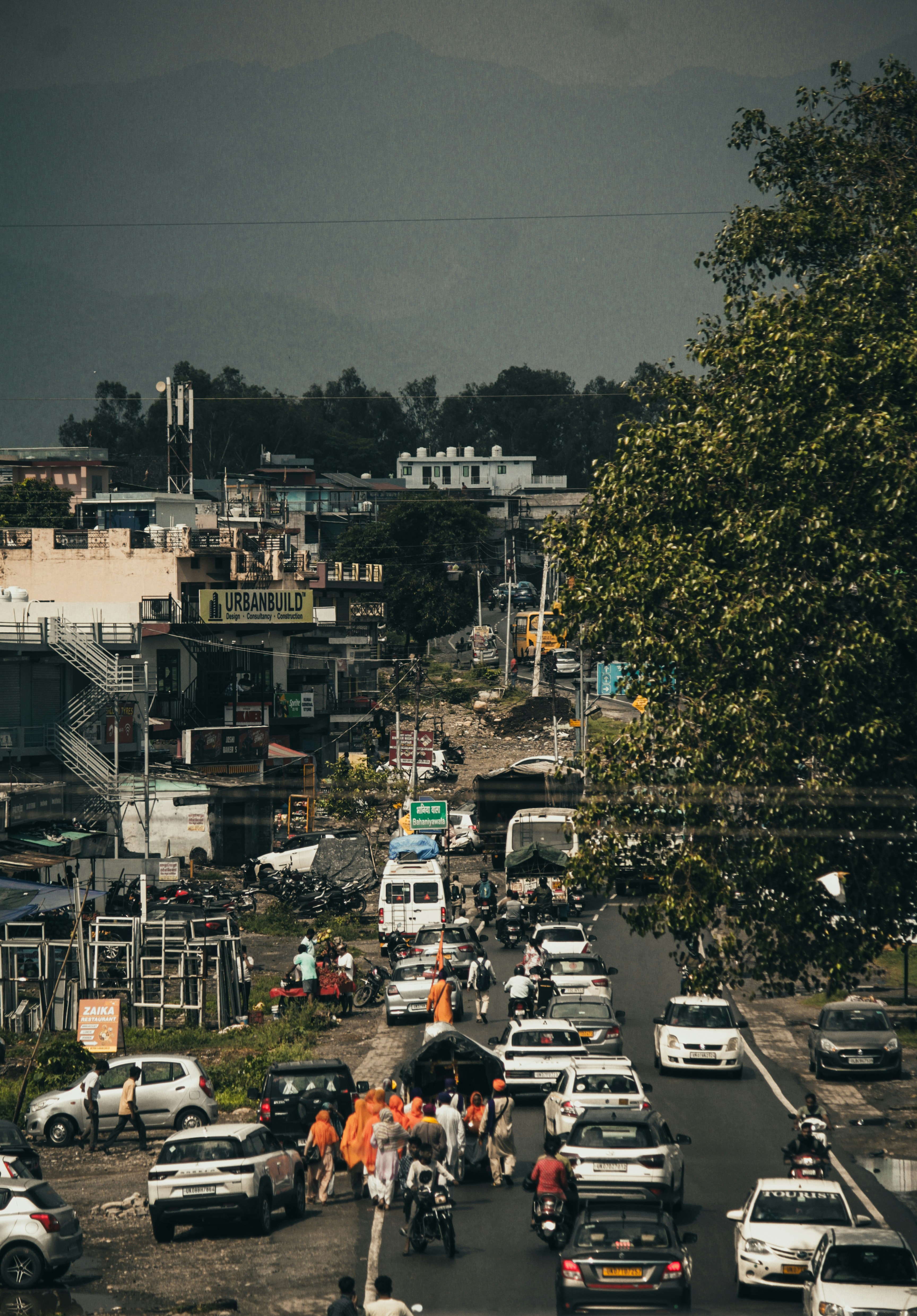 Traffic jams a busy street with houses and trees. photo – Free Image on ...